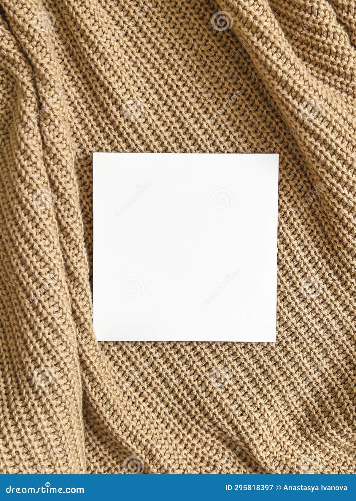 An Empty White Square Mockup on a Beige Knitted Background. Stock Image ...