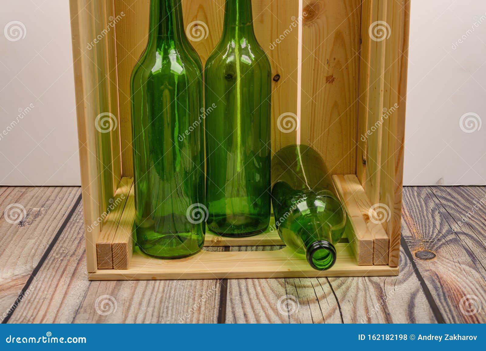 Empty Wine Bottles in a Wooden Box on the Table. Home Winemaking Stock ...