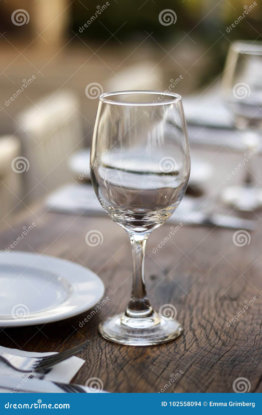 Empty Wine Glass Stands on a Wooden Table Stock Photo - Image of ...