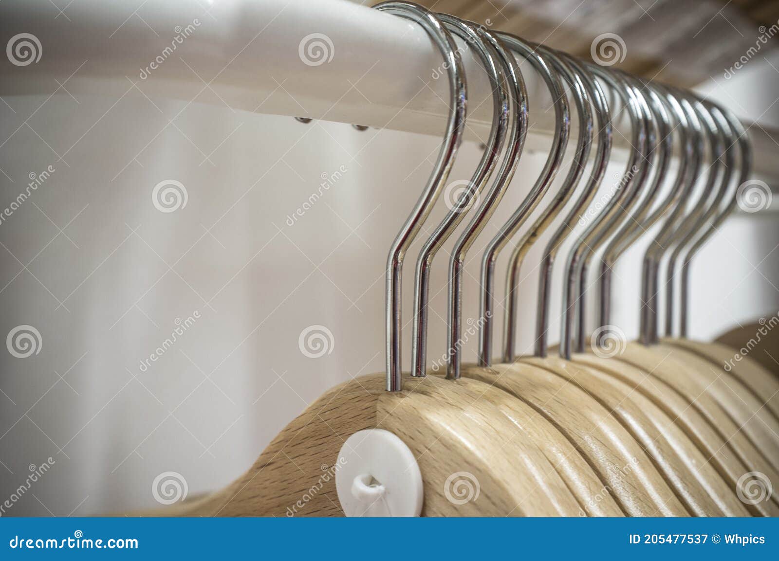 Empty wooden hangers stock image. Image of selective - 205477537