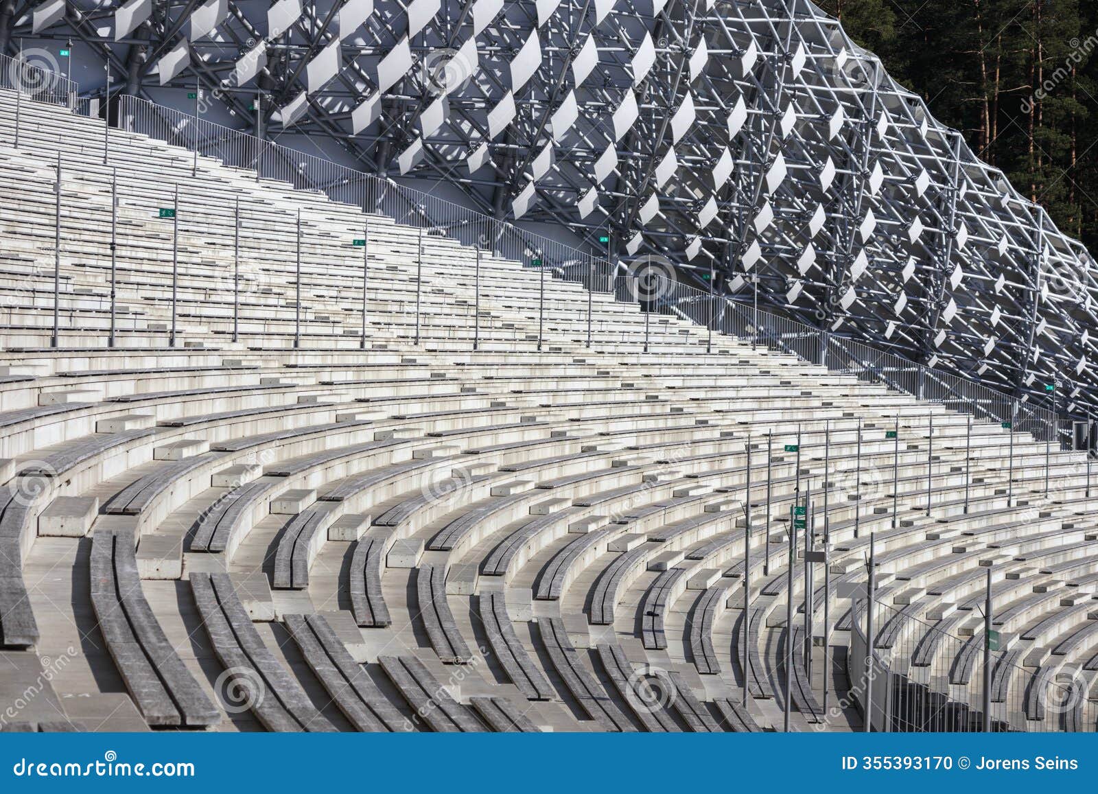 .an Empty, Wooden-seated Amphitheater with Concrete Structures and an ...