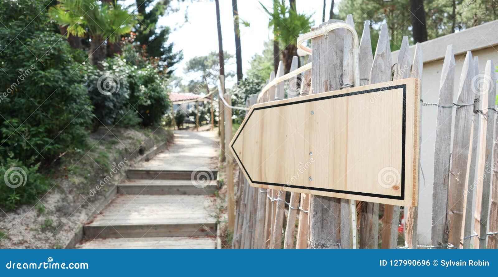 Sign Indicates the Direction of a Path Stock Photo - Image of wooden ...