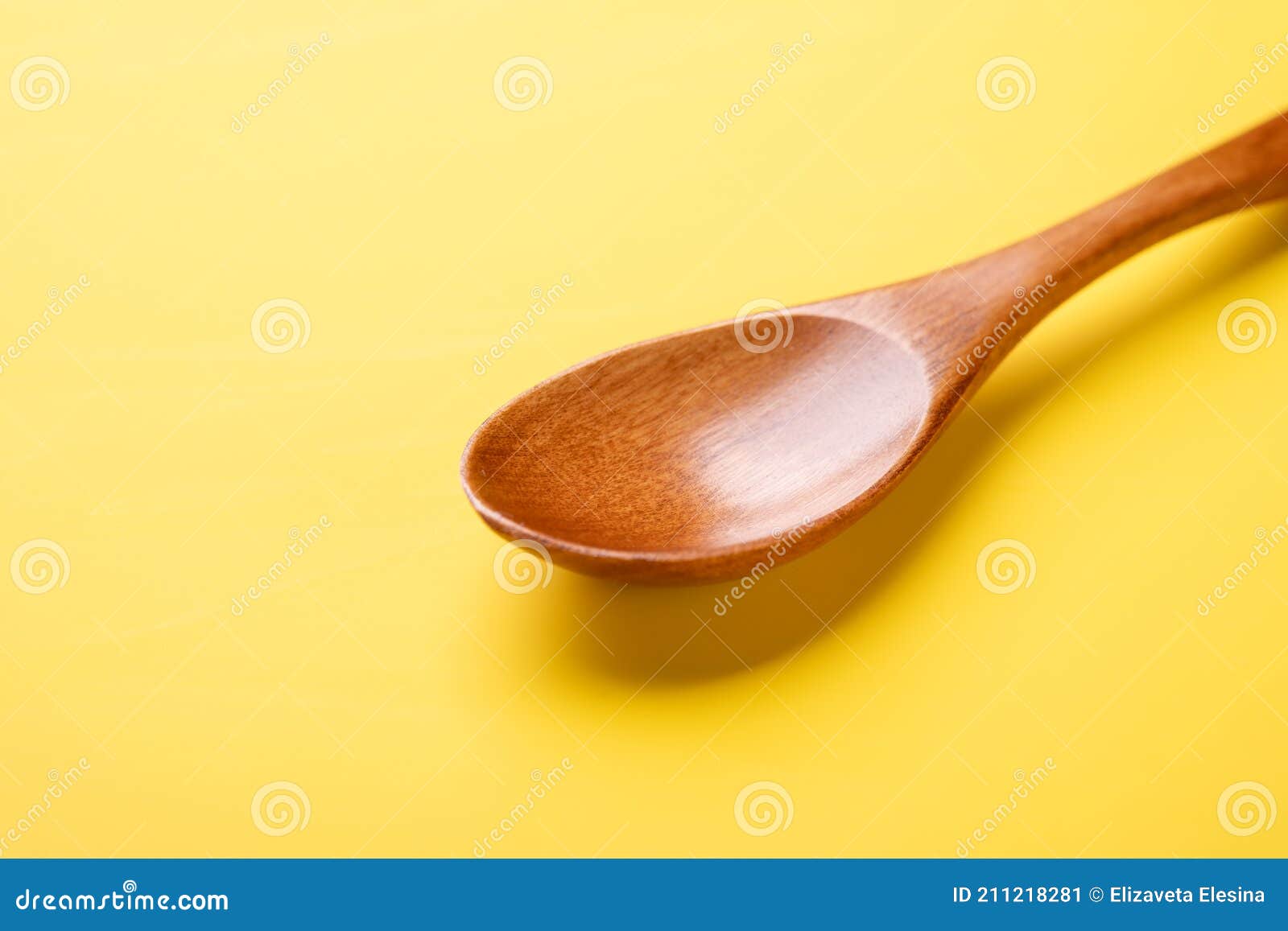 Empty Wooden Spoon on Yellow Background Stock Image - Image of reuse ...