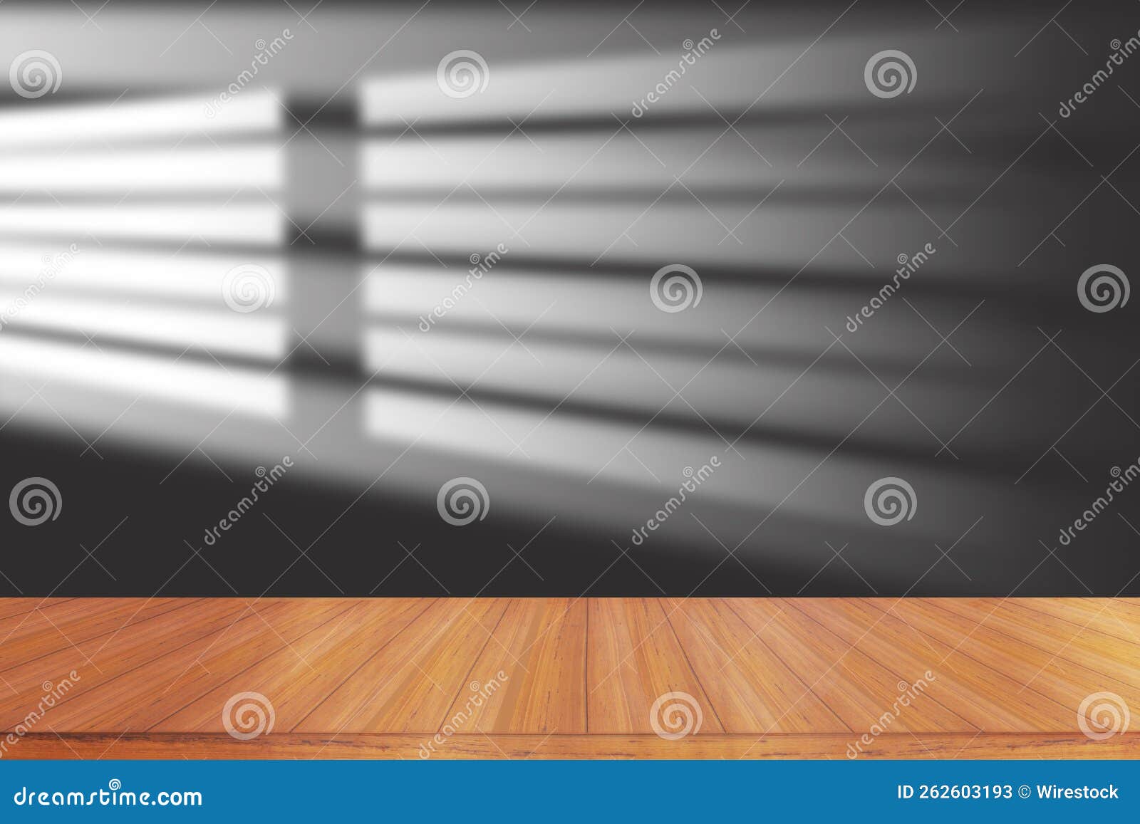 Empty Wooden Table in Front of Dim Light and Shadow on a Dark Room Wall ...