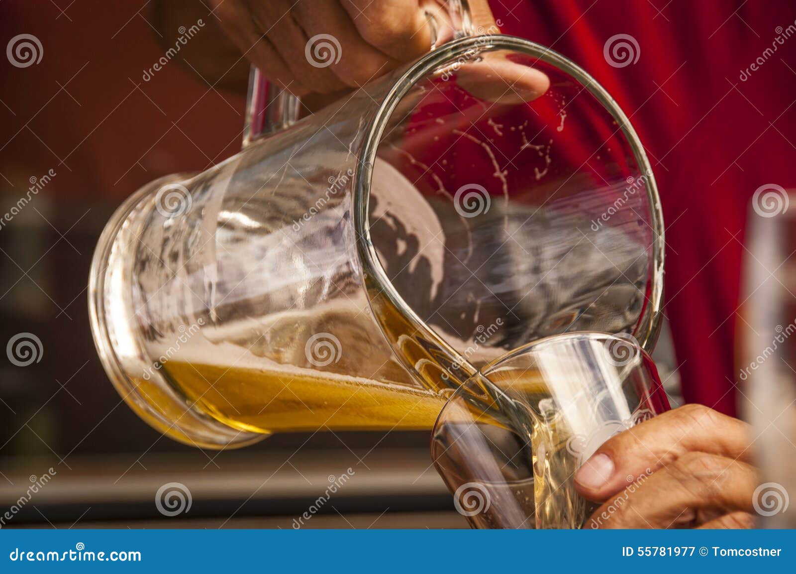 Emptying a pitcher of beer stock image. Image of last - 55781977