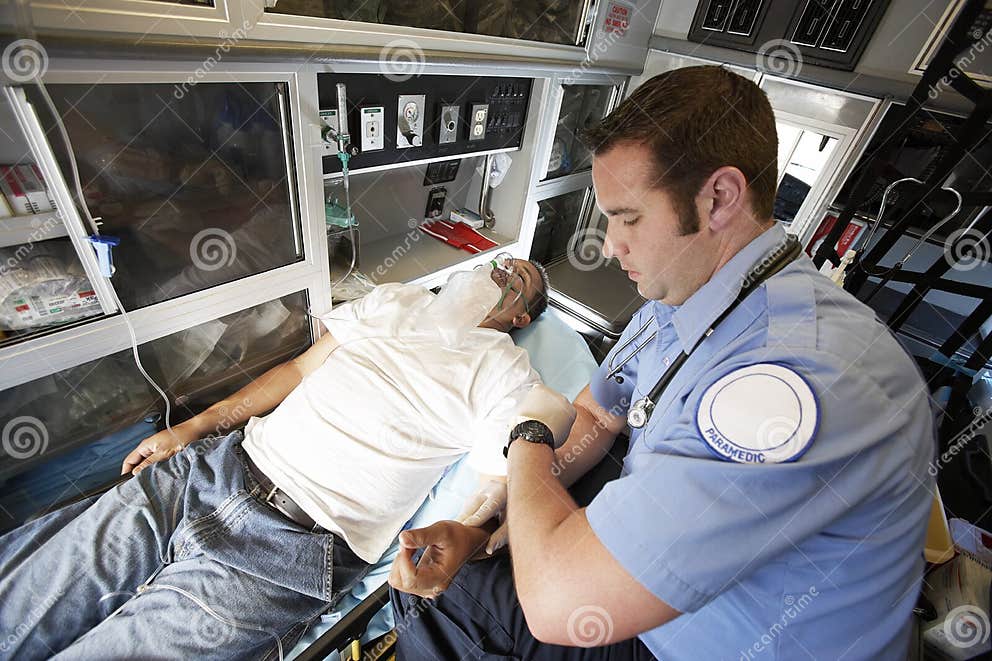 EMT Professional Taking Pulse of a Man Stock Image - Image of person ...