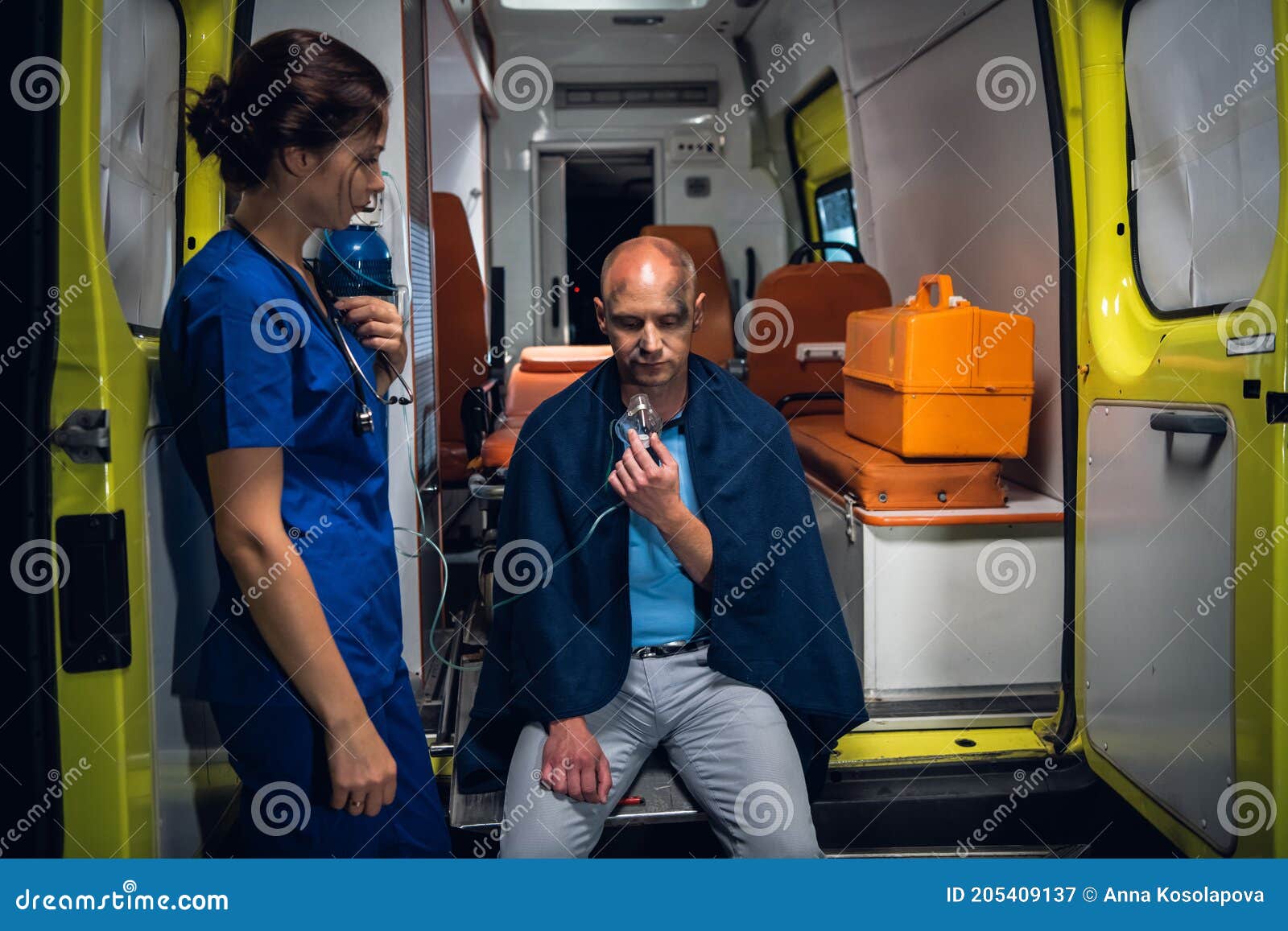 An EMT Taking Care of a Man Rescued from the Fire Stock Image - Image ...