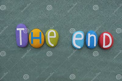 The End, Creative Text Composed with Multi Colored Stone Letters Over ...