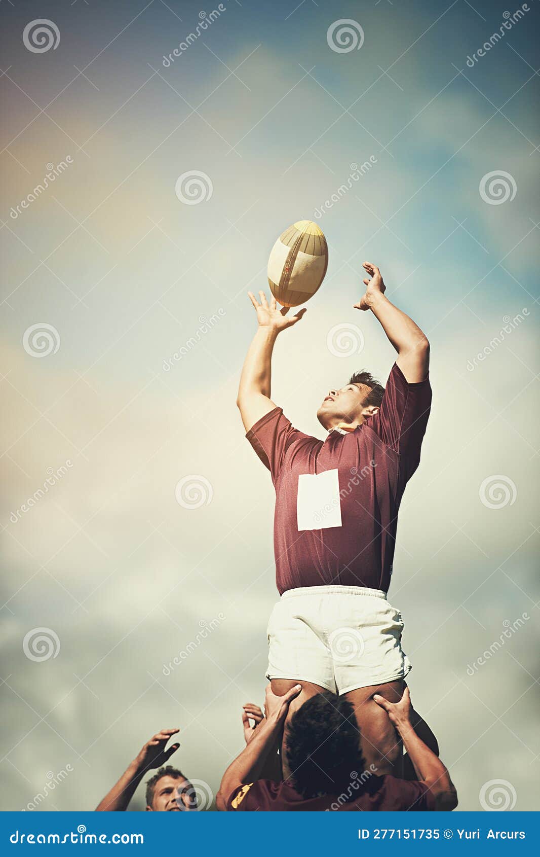 On the End of a Long Throw. a Young Rugby Player Catching the Ball ...