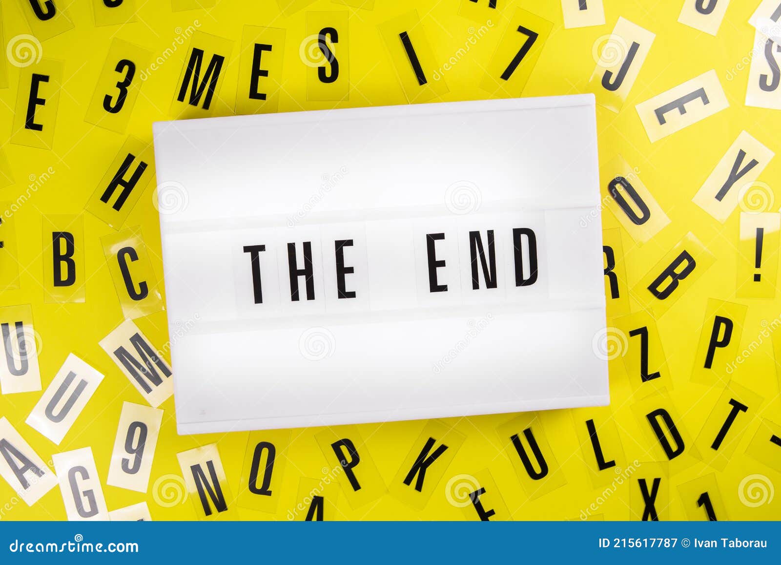 The End Message on Lightbox on Scattered Letters Background of Plastic ...