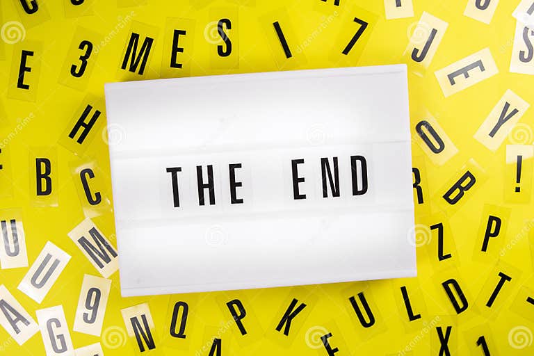The End Message on Lightbox on Scattered Letters Background of Plastic ...