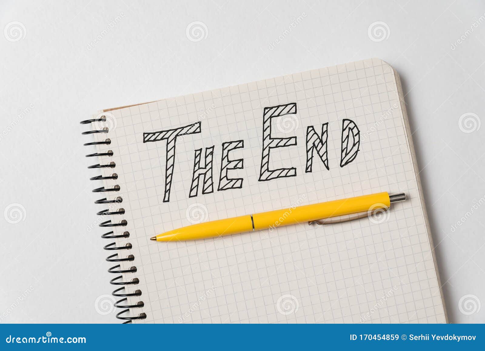 The End Notice In Notebook. Notepad, Pen And Cup Of Coffee On White ...