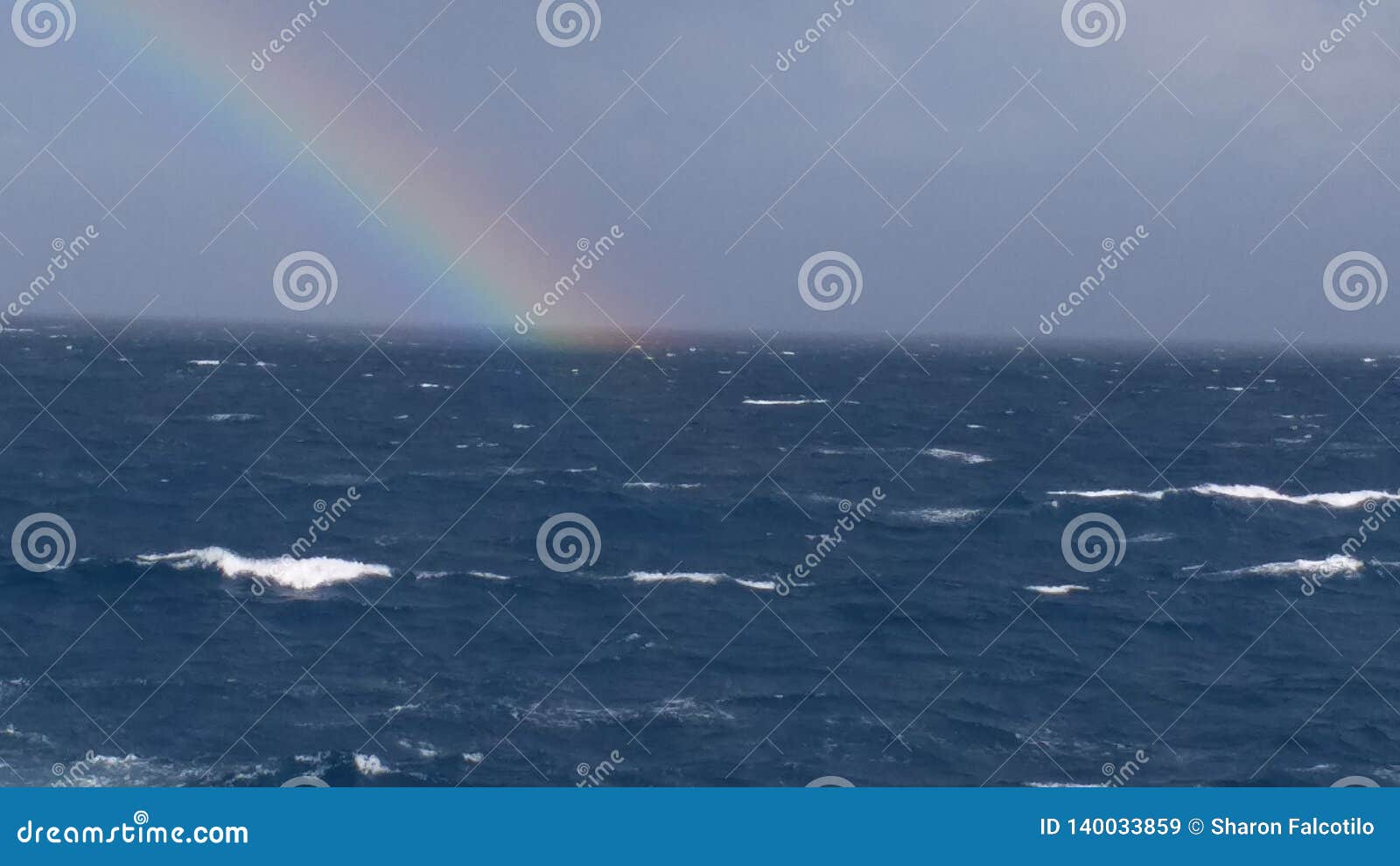 Rainbow on the ocean 2 stock image. Image of tropical - 140033859
