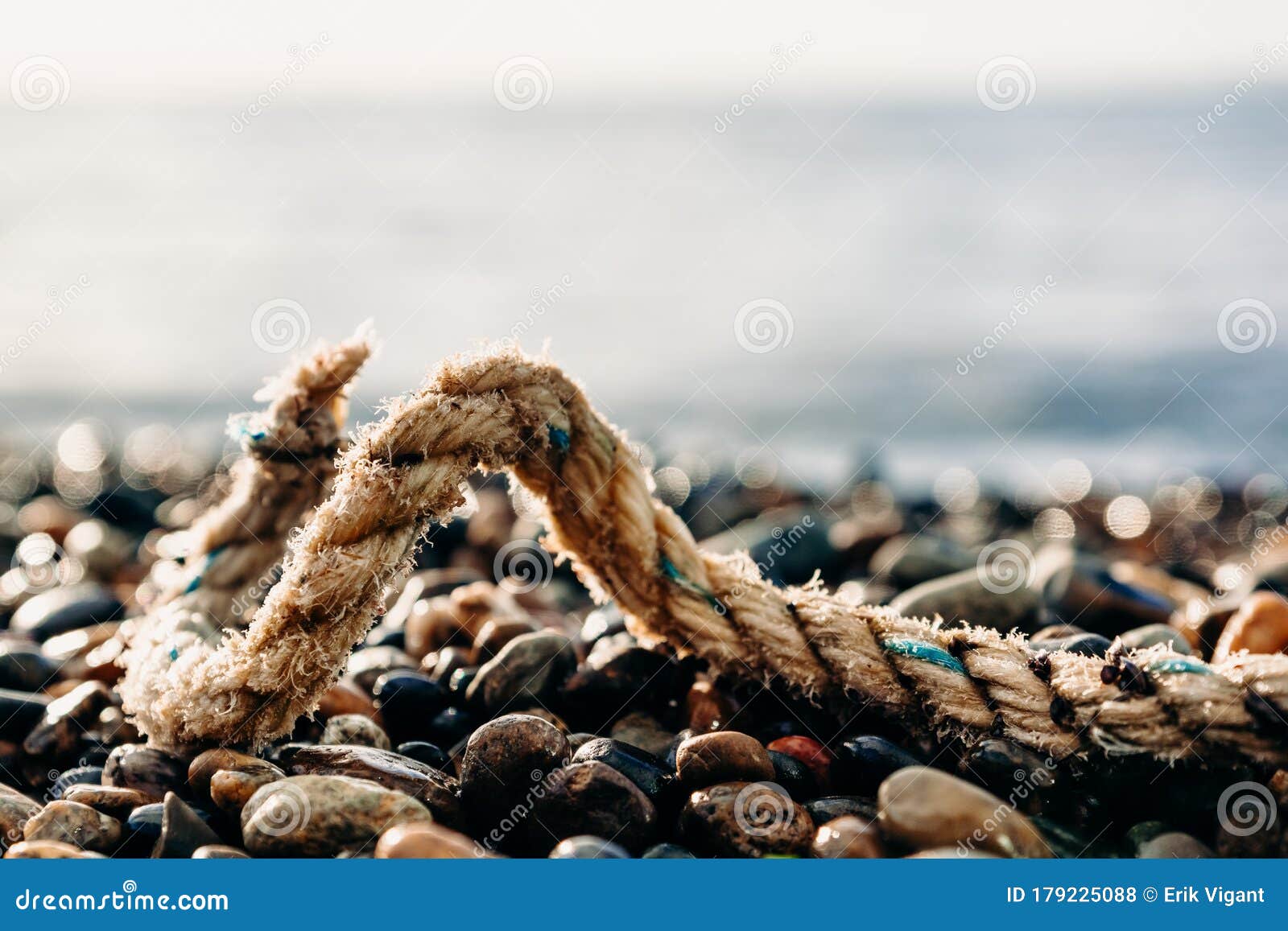 The End of the Rope Lies on a Stone Sea Beach Stock Photo - Image of ...