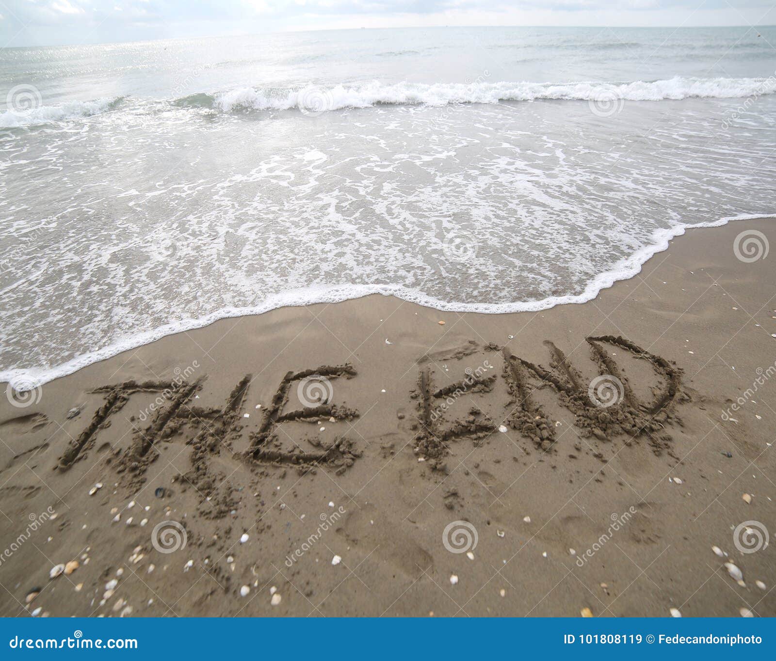 The END Text Written on the Sand and the Wave that is Deleting T Stock ...