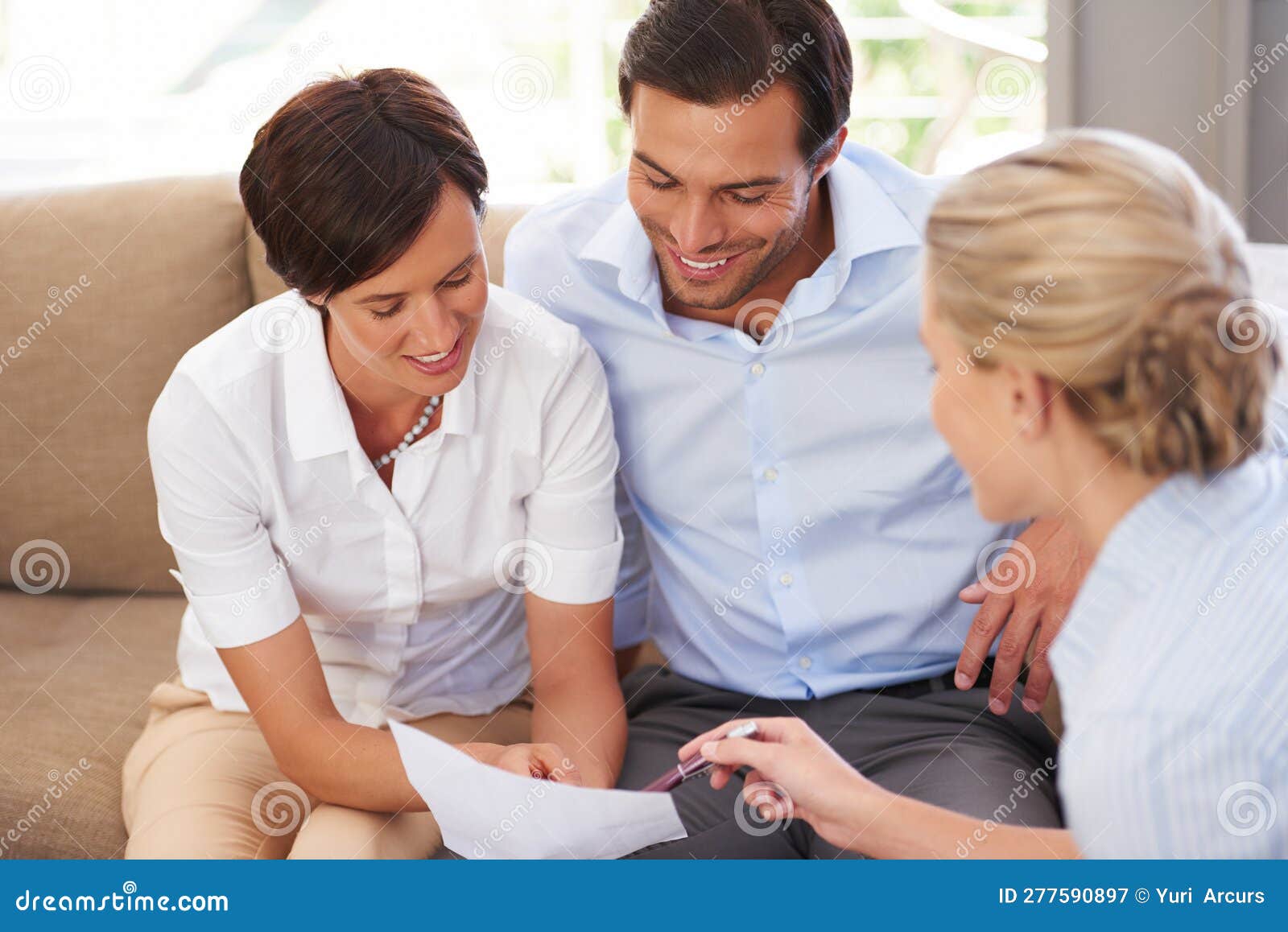 In the End it Will Pay Off. a Financial Advisor Explaining Documents To ...