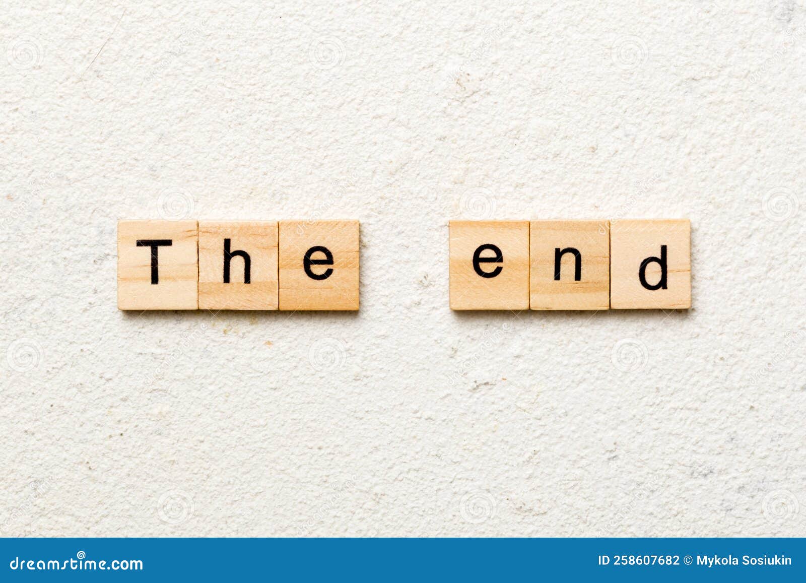 The End Word Written on Wood Block. the End Text on Cement Table for ...