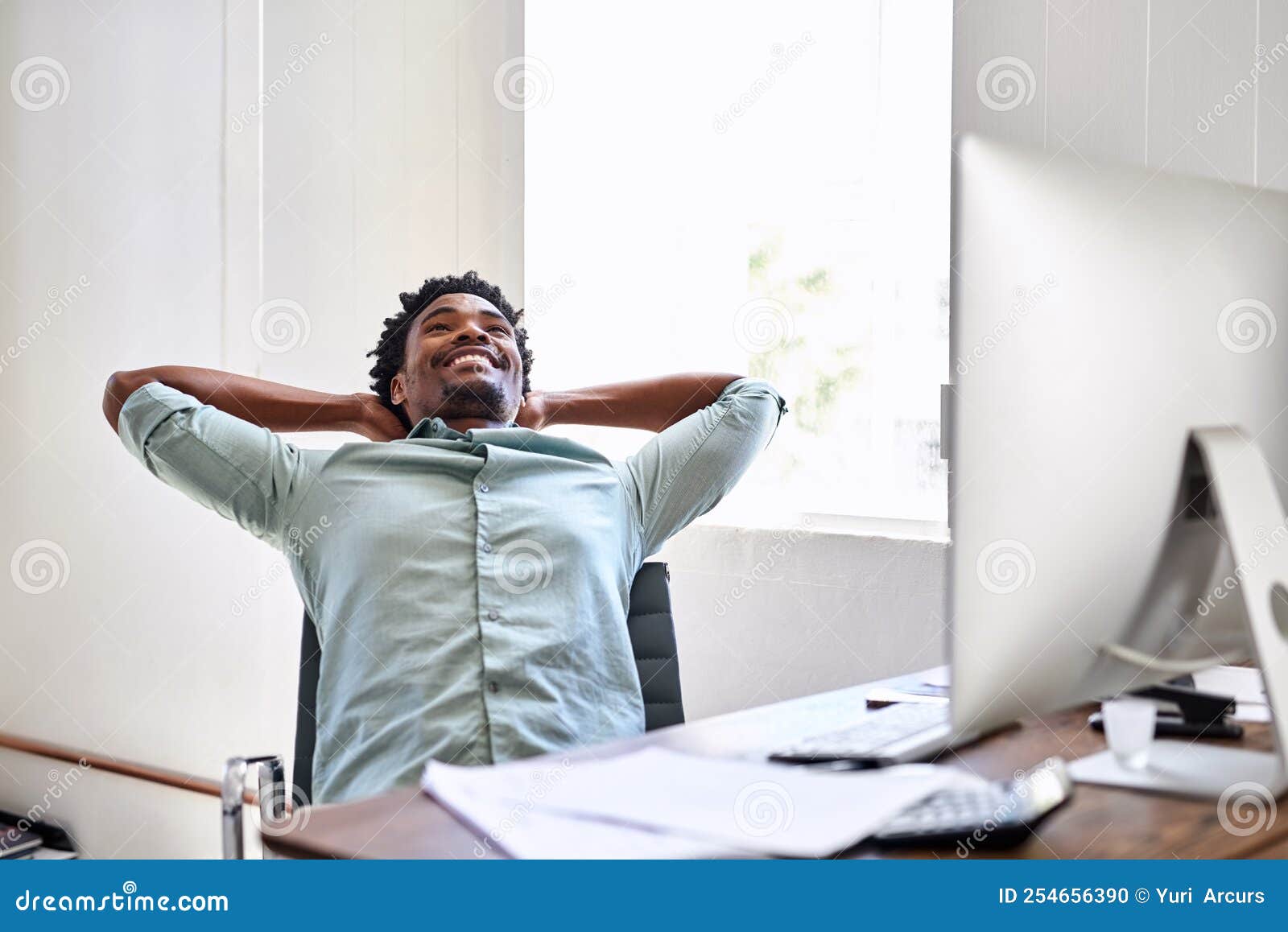 Ending Off Another Productive Day. a Young Designer Taking a Break at ...