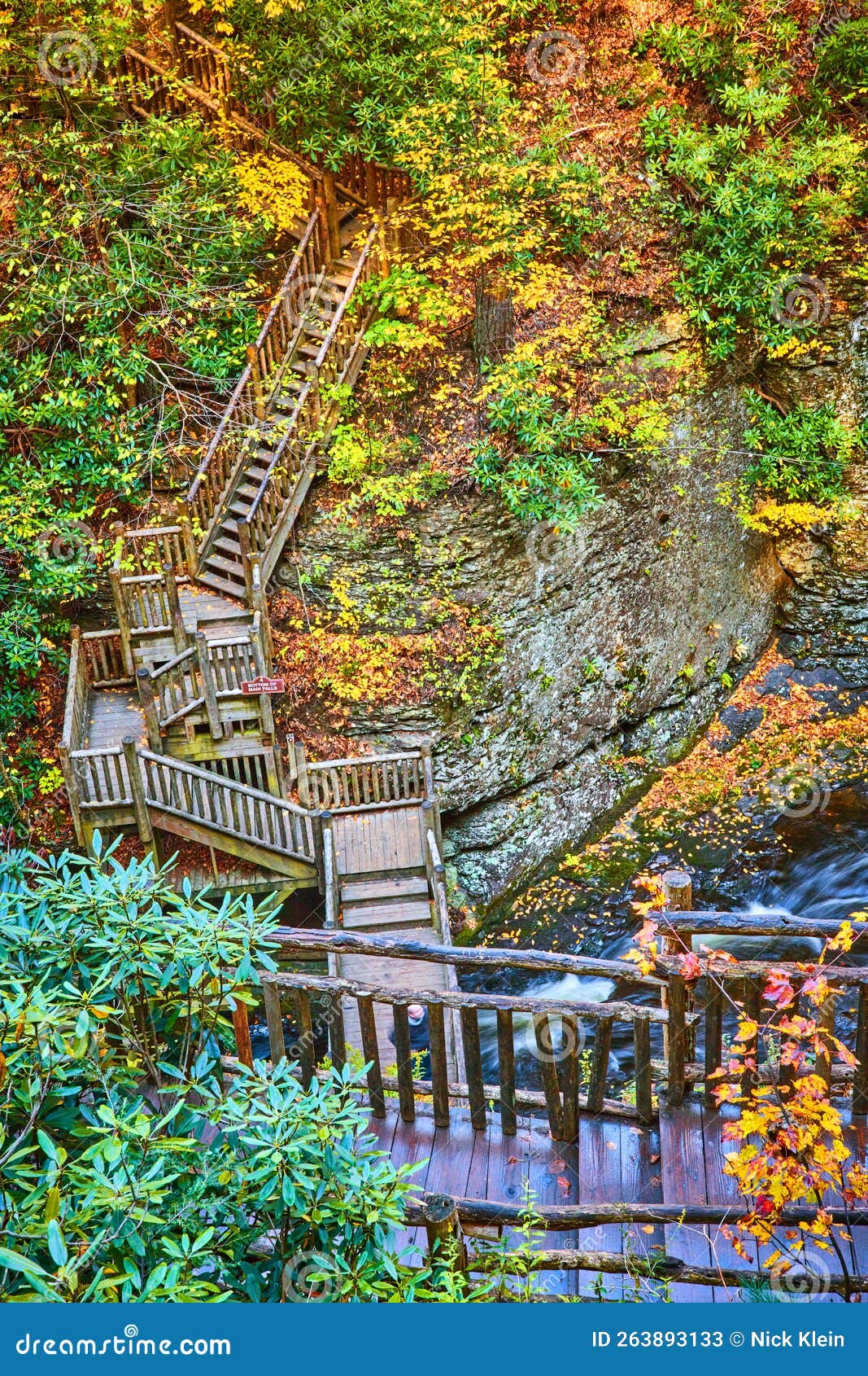 Endless Boardwalk Stairs Across River and Up Cliffs Surrounded by Fall ...