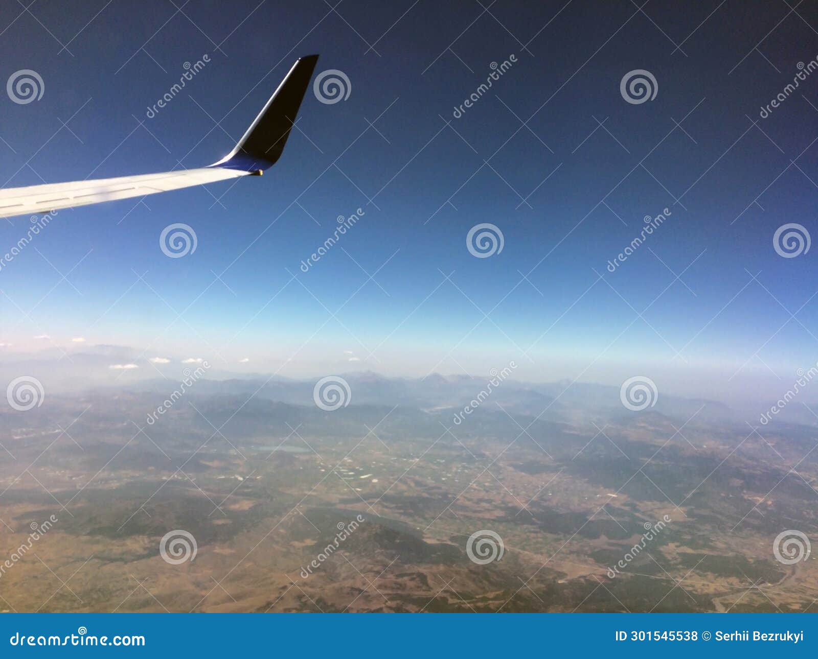 Endless Clouds and Blue Sky Under the Wing of the Plane Stock Photo ...