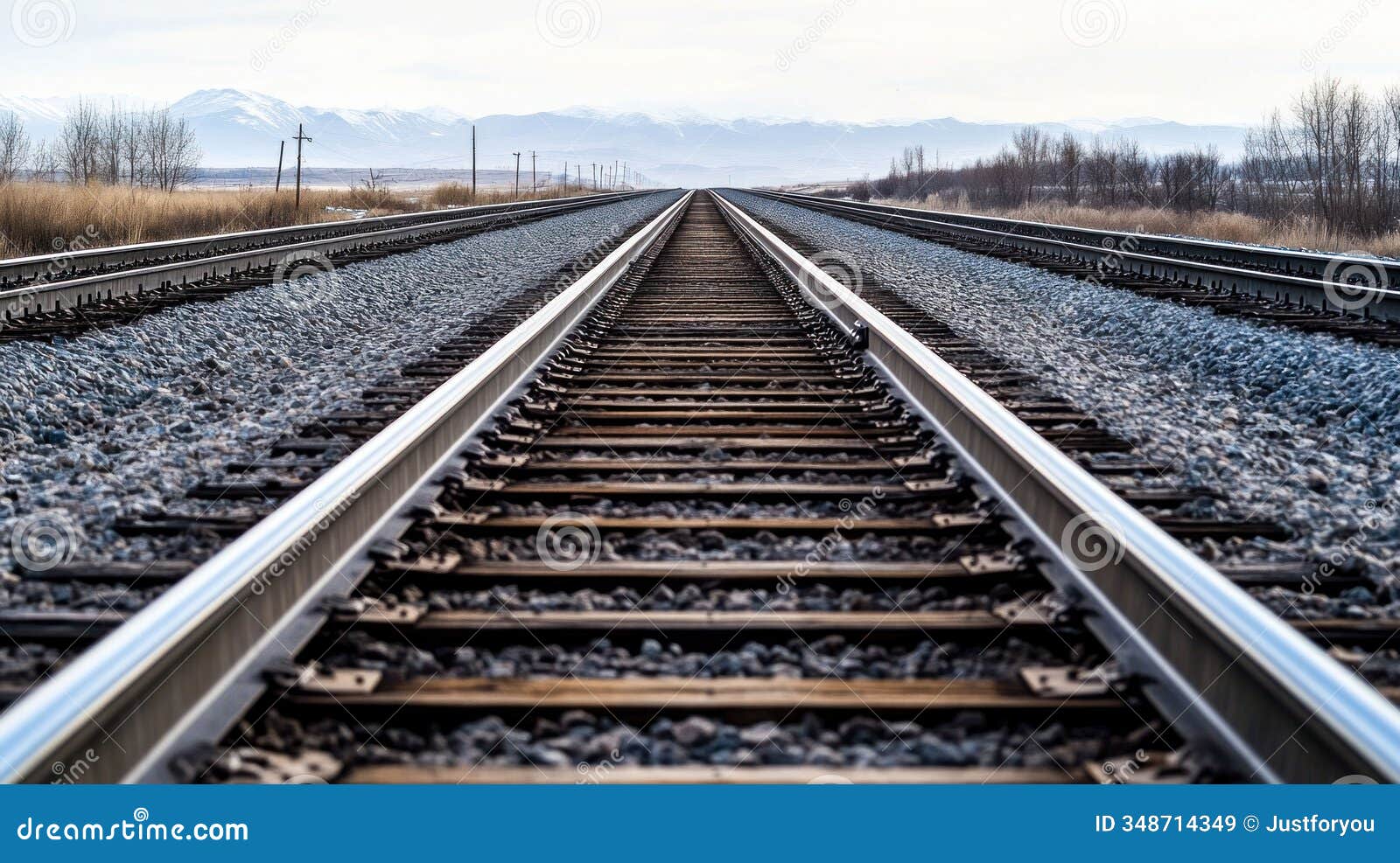 Endless Train Track in Vast Open Landscape with Mountain View Stock ...