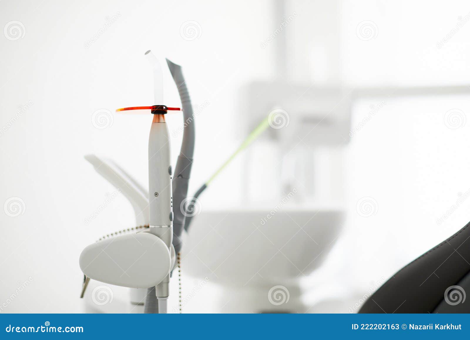 Endodontic Instruments on White. Dental Polymerization UV Lamp. UV Tool ...