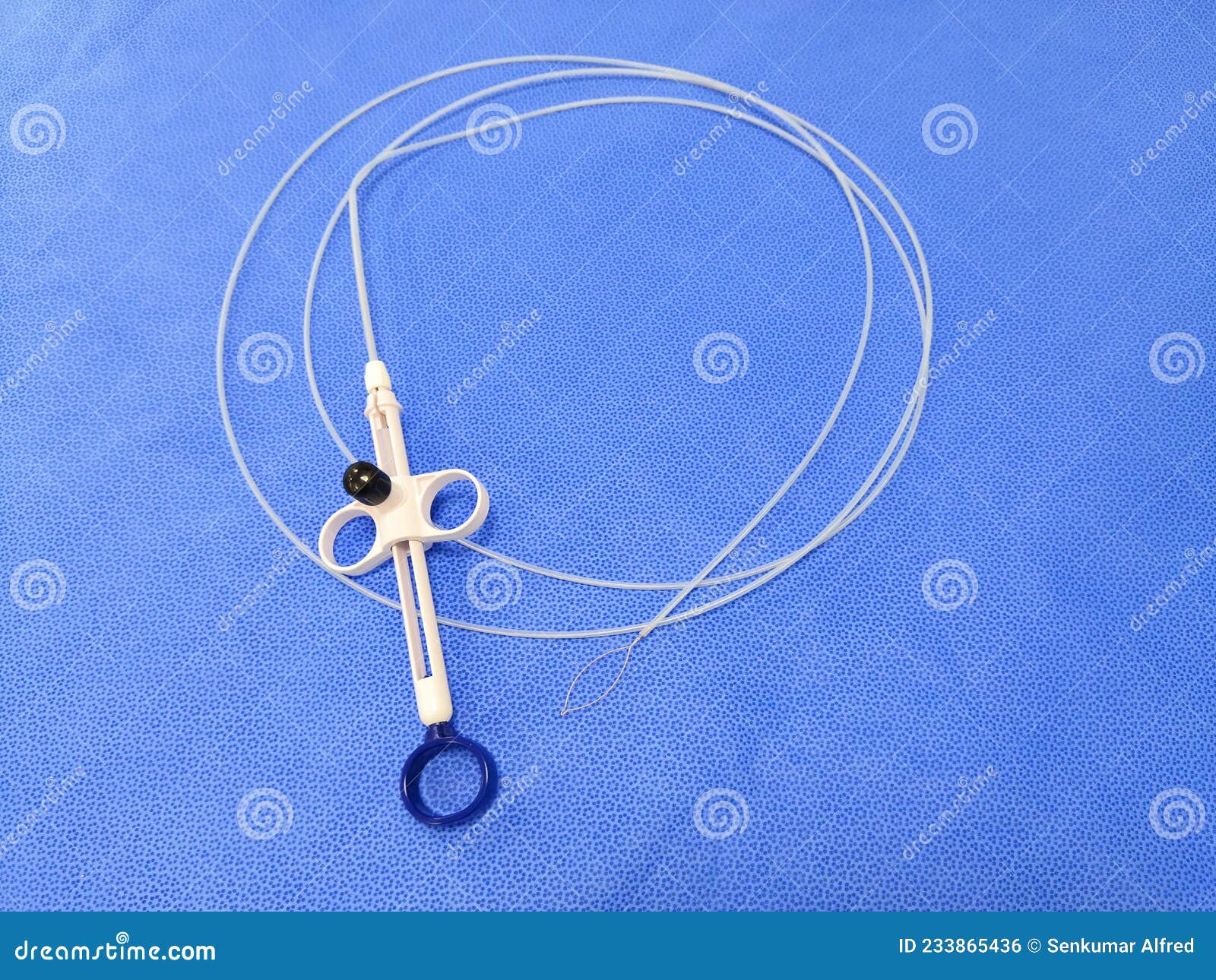 Endoscopic Instrument Polypectomy Snare in Blue Background. Selective ...
