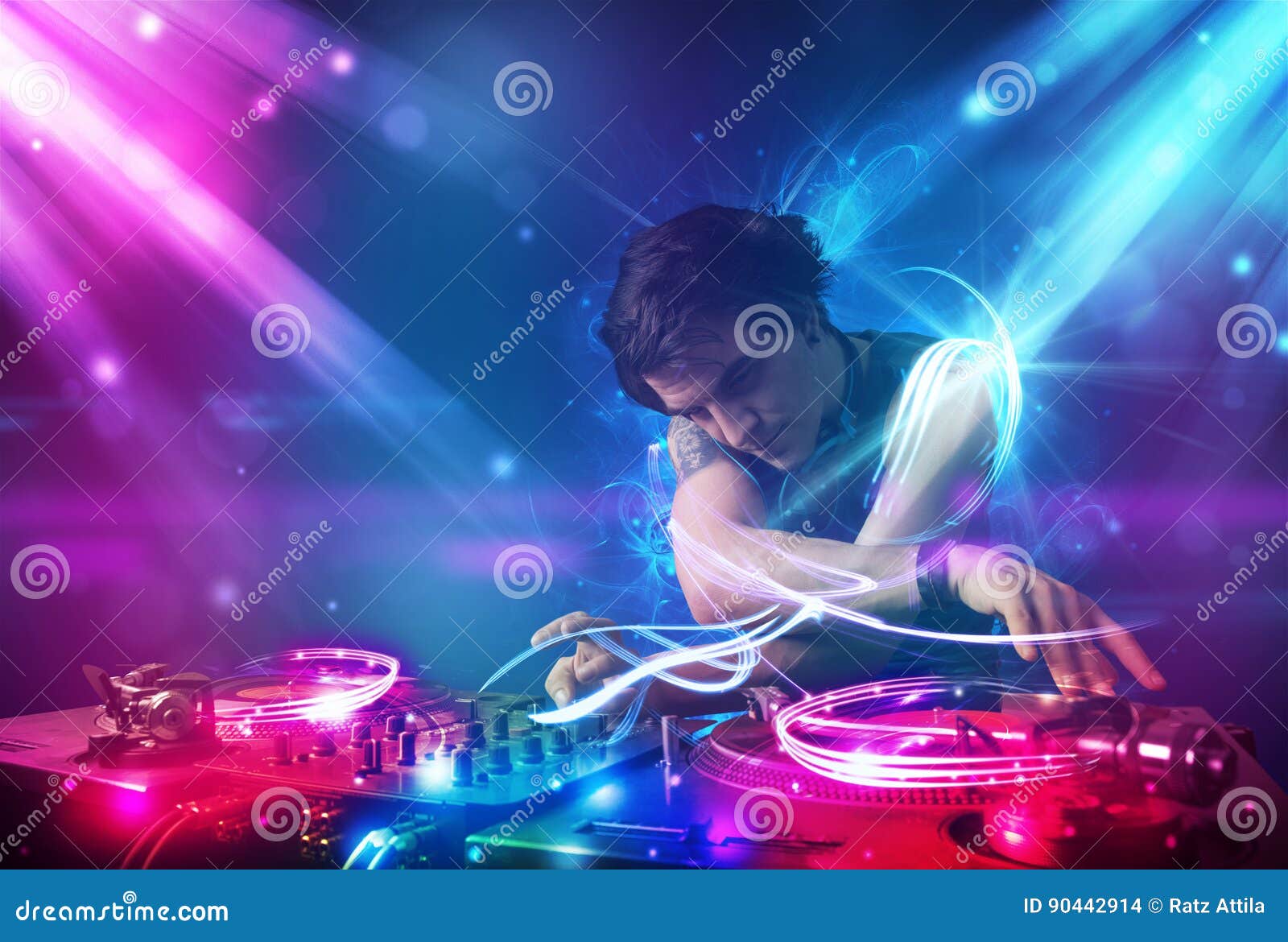 Energetic Dj Mixing Music with Powerful Light Effects Stock Photo ...