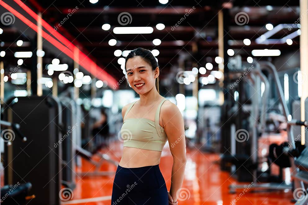 Energetic Fitness Sportswoman At Gym Asian Woman Athlete Standing And
