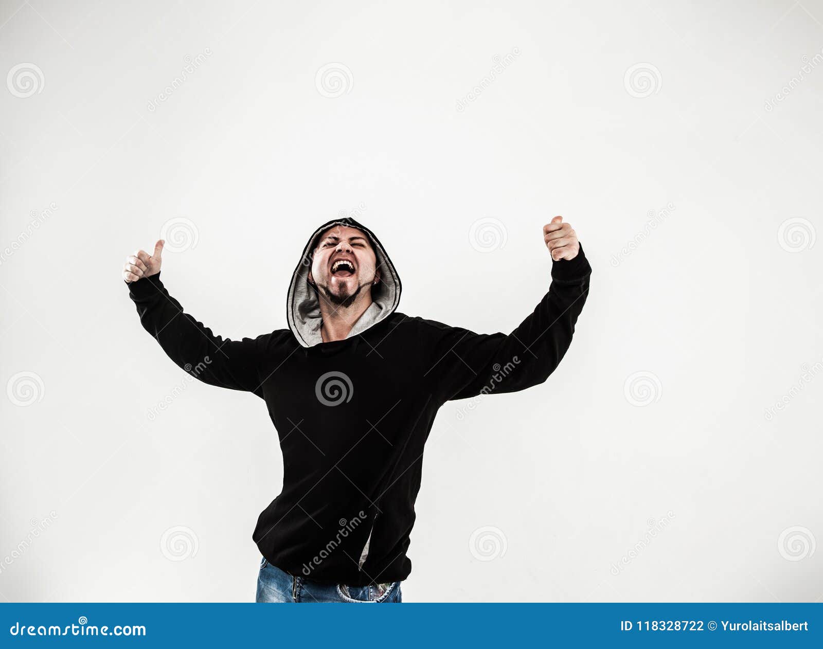 Portrait of a Energetic Guy Rapper on a Light Background Stock Photo ...