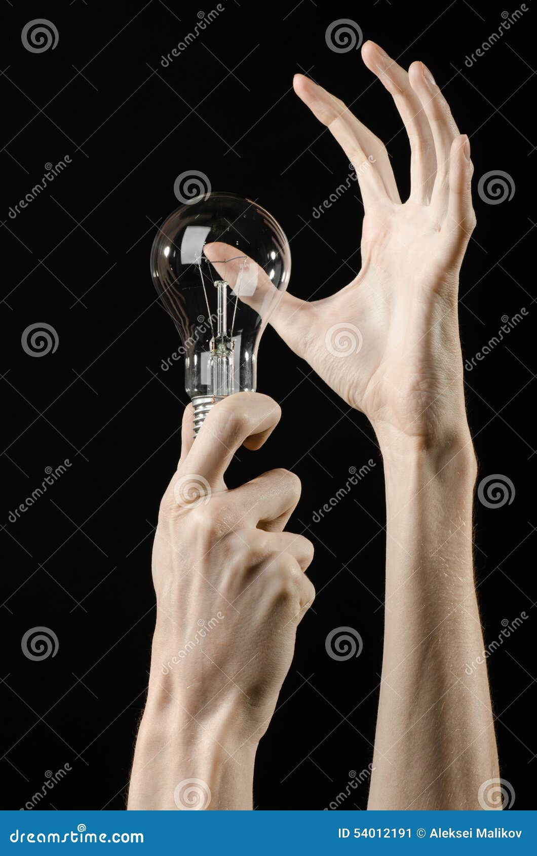 Energy Consumption and Energy Saving Topic: Human Hand Holding a Light ...