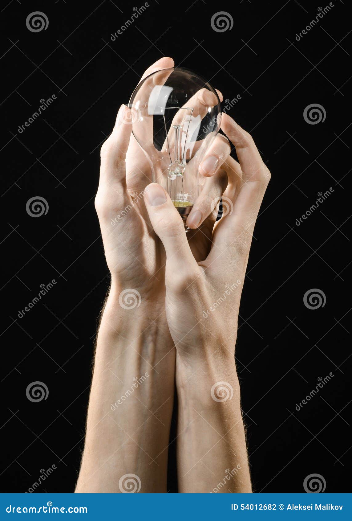 Energy Consumption and Energy Saving Topic: Human Hand Holding a Light ...