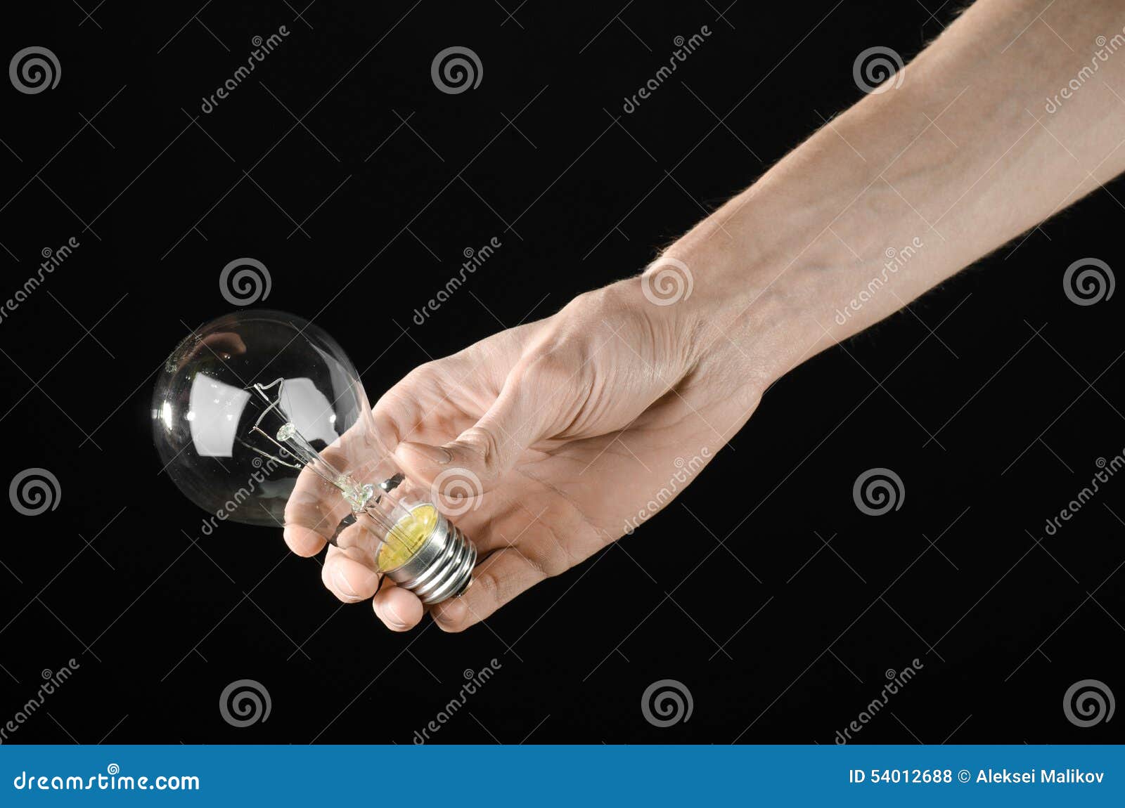 Energy Consumption and Energy Saving Topic: Human Hand Holding a Light ...