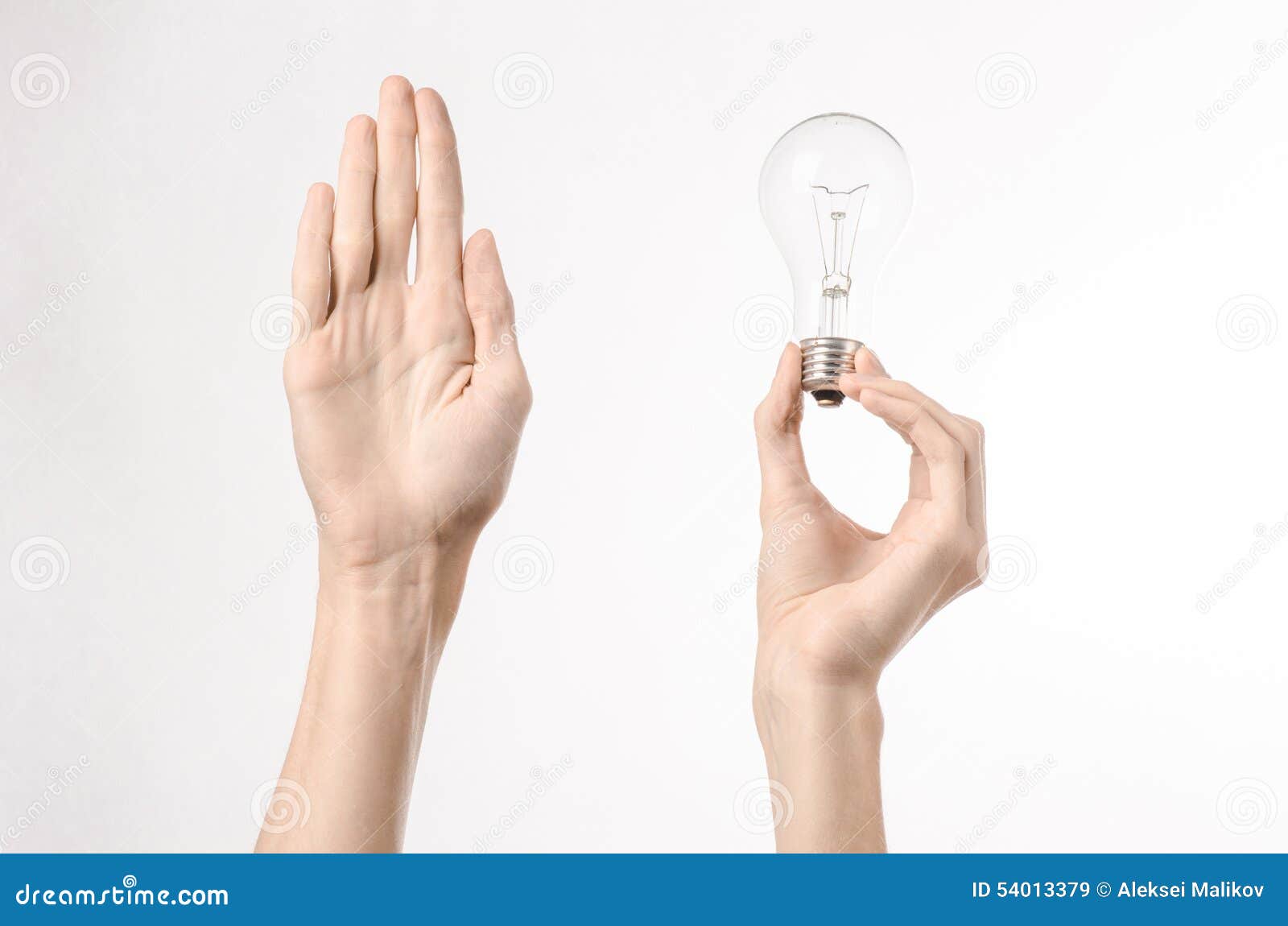 Energy Consumption and Energy Saving Topic: Human Hand Holding a Light ...