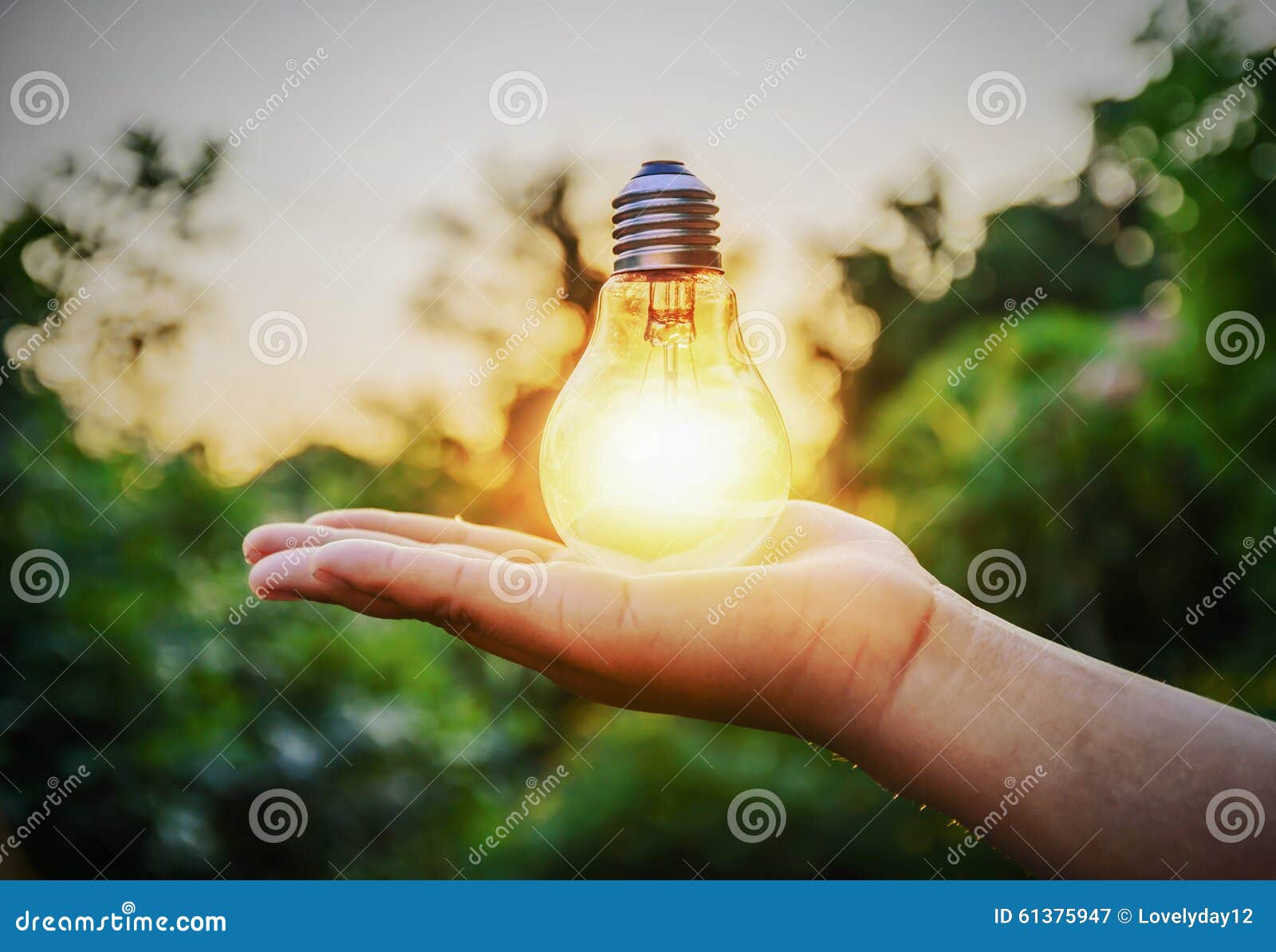 Energy Light Bulb from Sunset on Hand Concept Stock Image - Image of ...