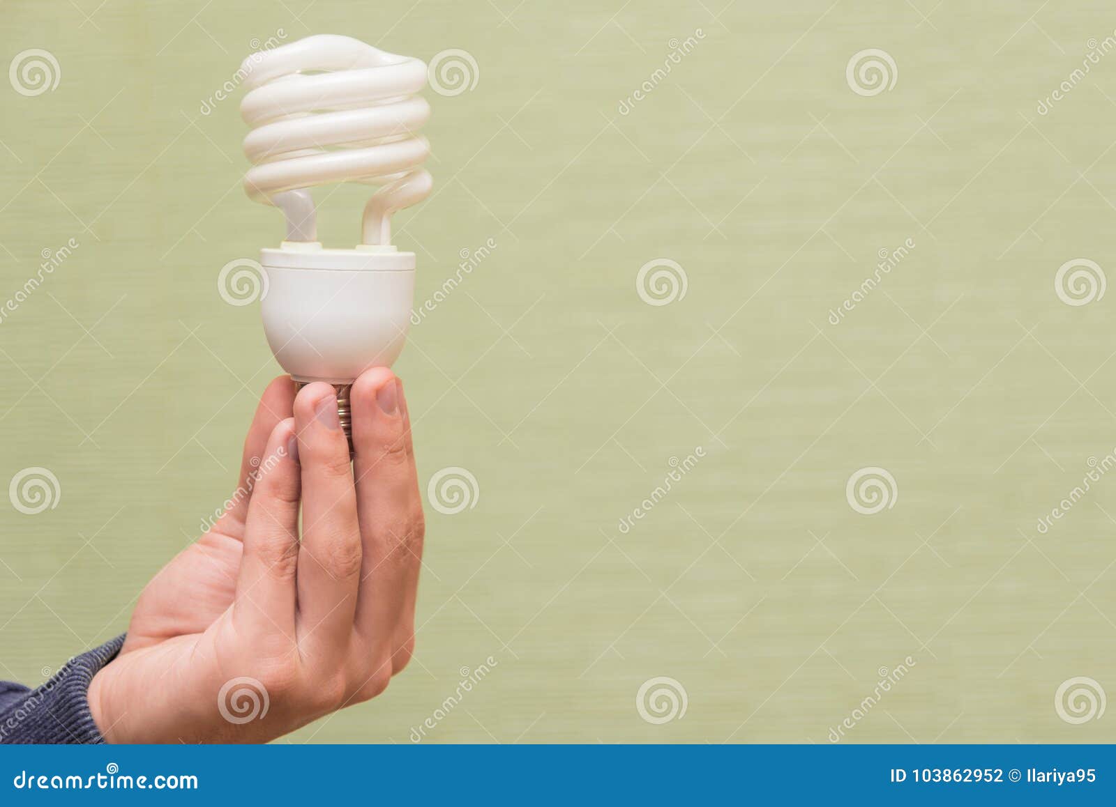 Energy Saving Light Bulb in the Hands of a Man Stock Photo - Image of ...