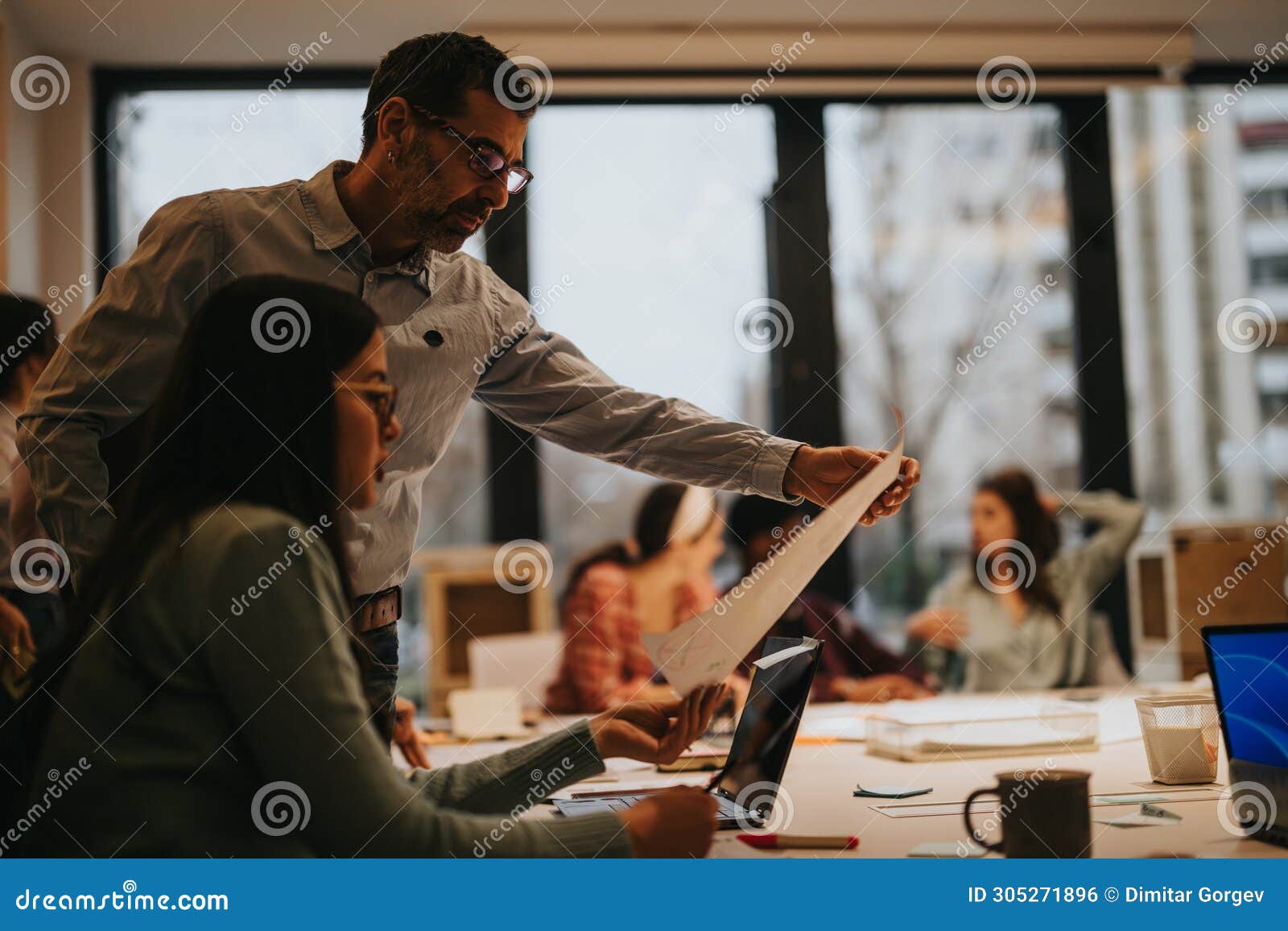 Team of People Engaged in Discussion during a Business Meeting. Focus ...