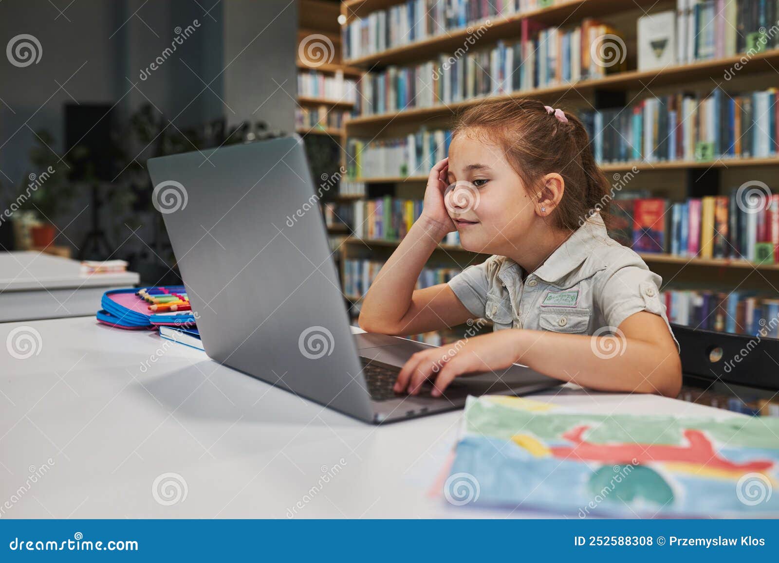 Engaged Student Doing Her Homework Using Laptop in after School Club at ...