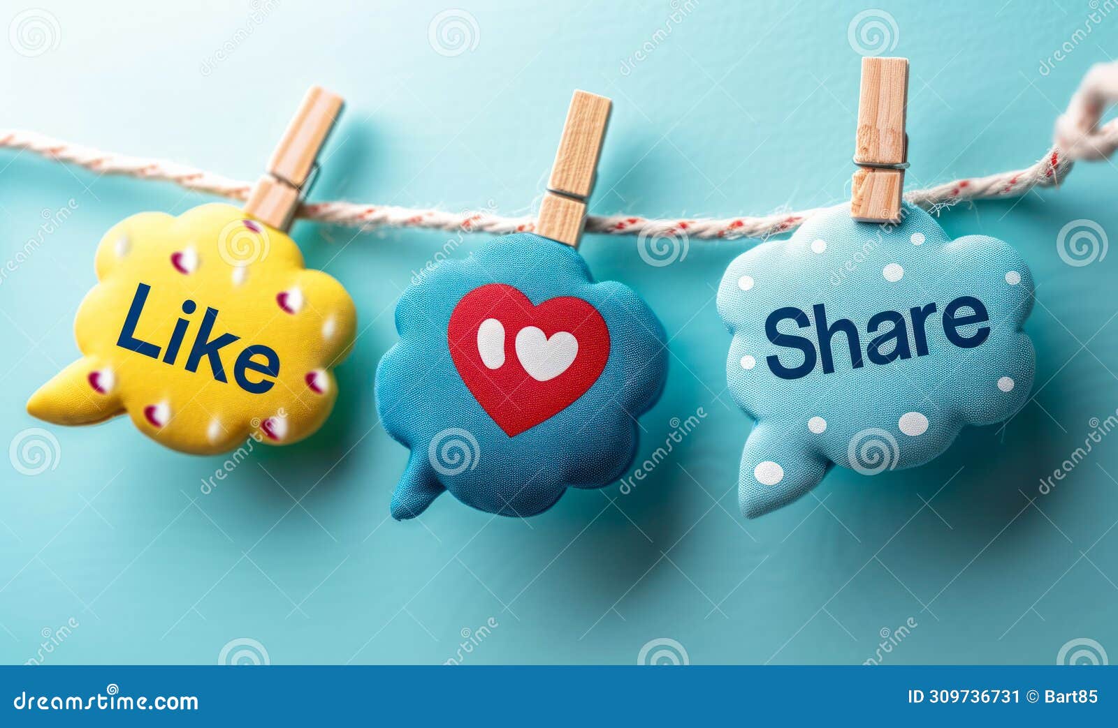 Engagement Concept with Like & Share Speech Bubbles Pinned on a String ...
