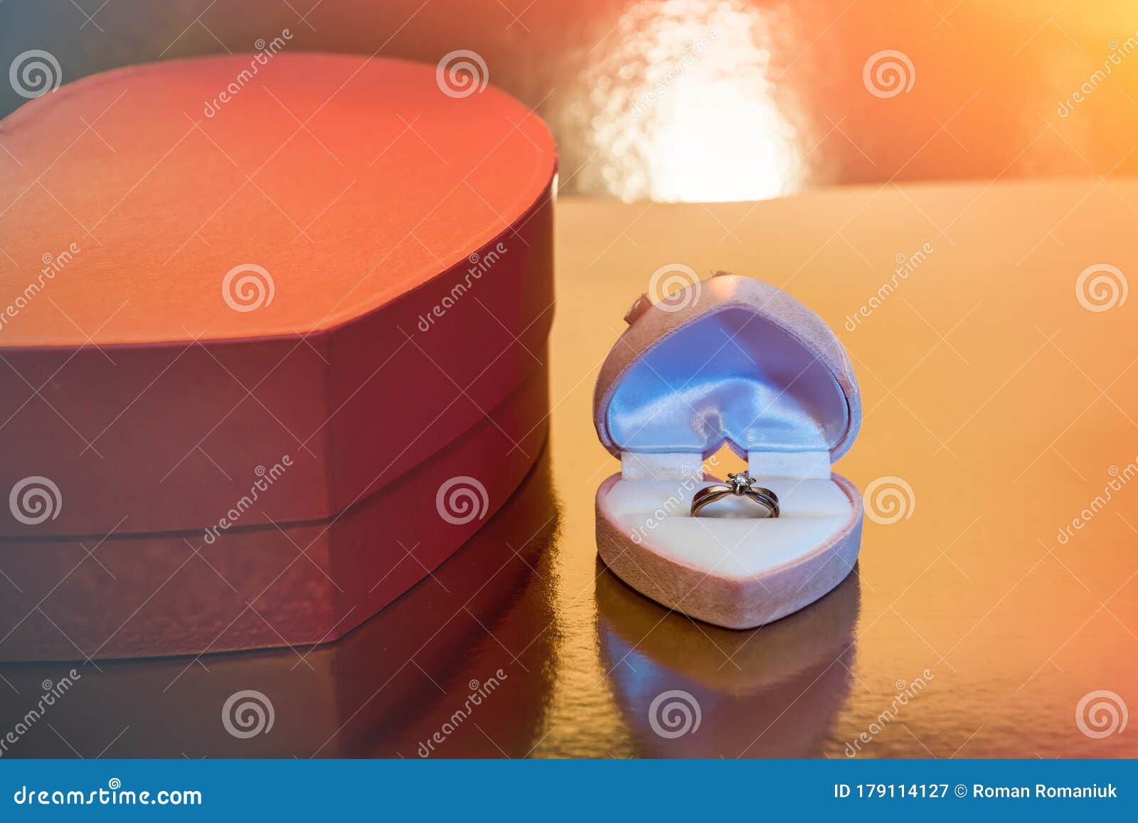 Engagement Proposal Ring in Box on the Gold Glitter Sparkle Background ...