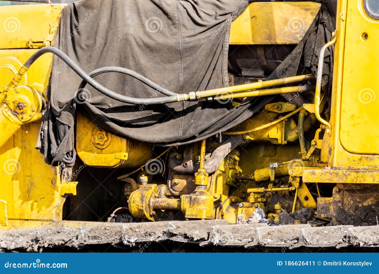 The Engine Compartment of the Caterpillar Tractor is Covered with an ...