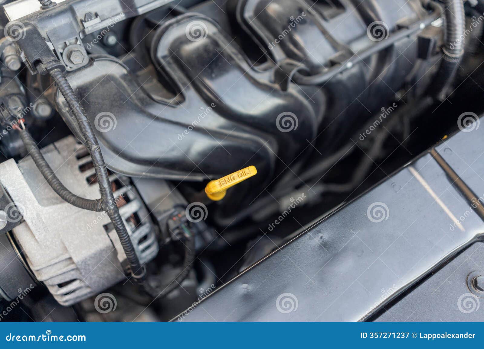 Engine Compartment with Visible Engine Oil Dipstick Labeled "ENG OIL ...