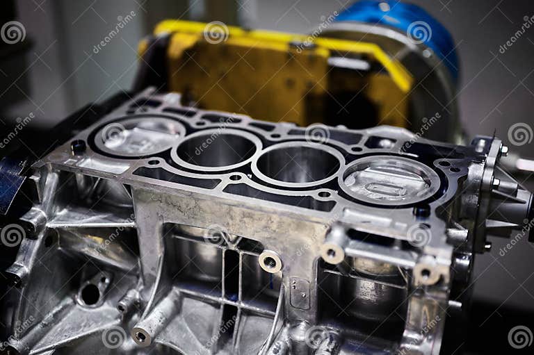 Engine Cylinder Block with Installed Pistons in Workshop Stock Photo ...