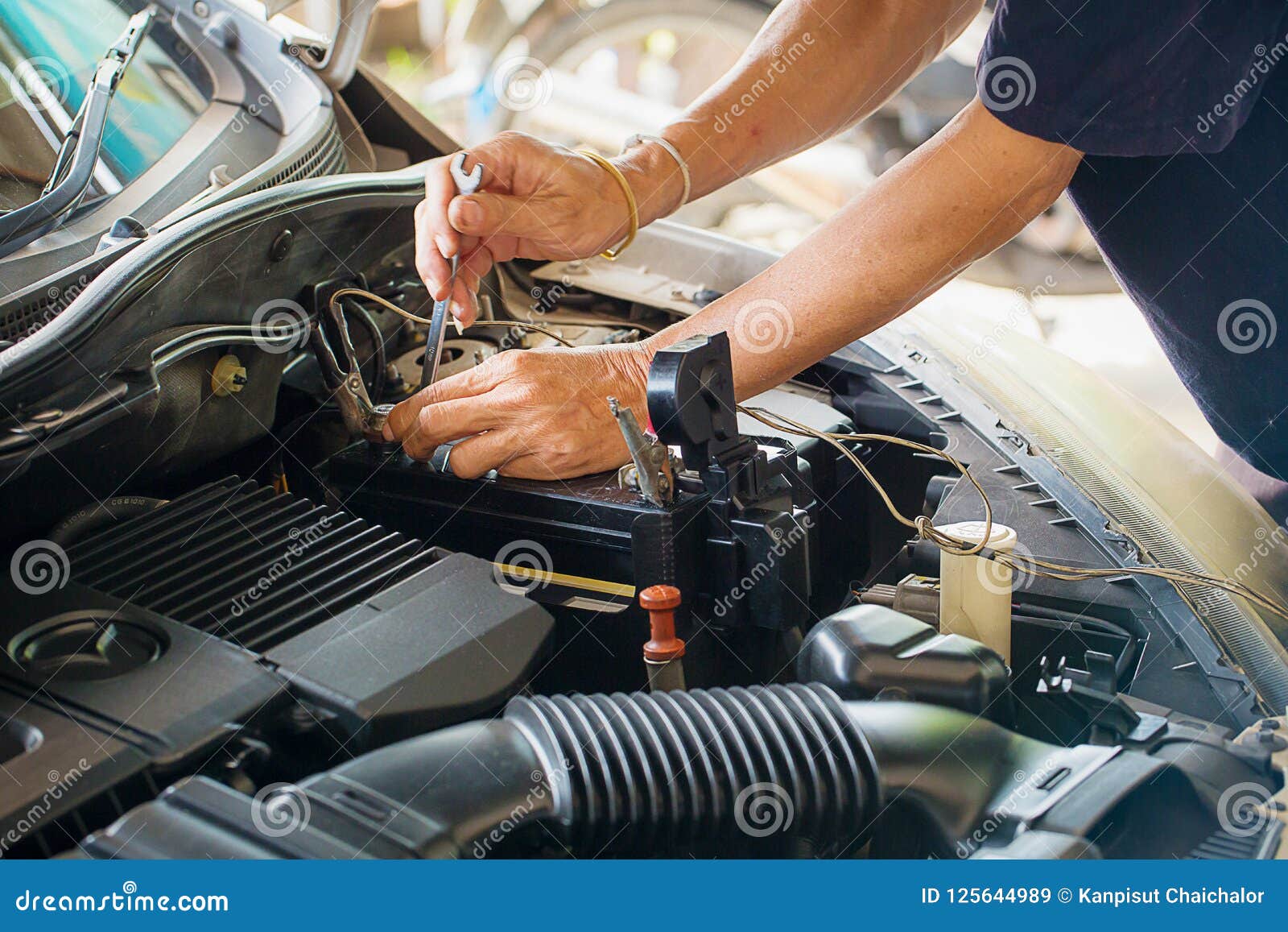 Engine Engineer Is Replacing Car Battery Because Car Battery Is ...