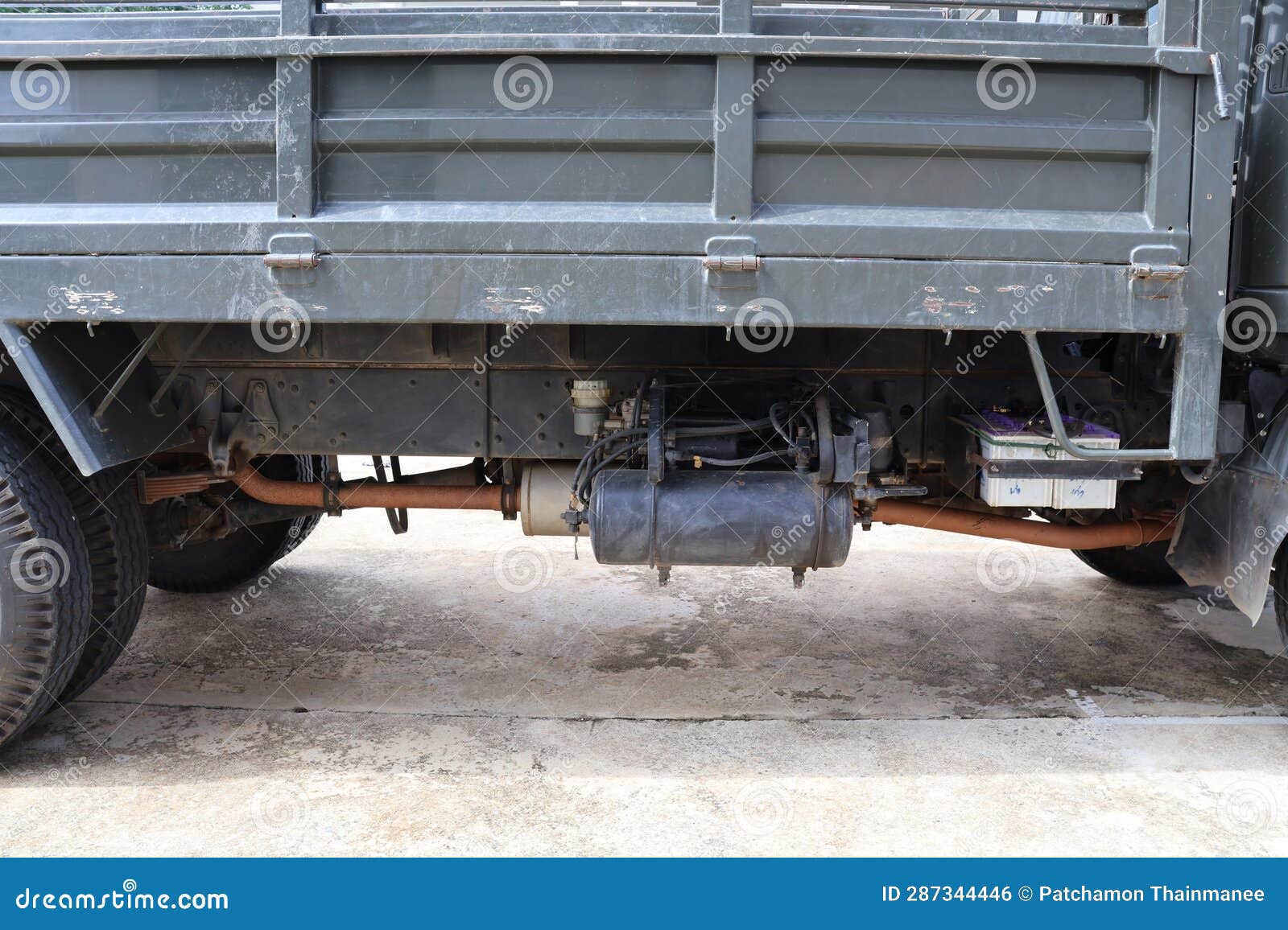 The Engine of a Heavy Truck Undercarriage Seen Under the Car and Wheels ...