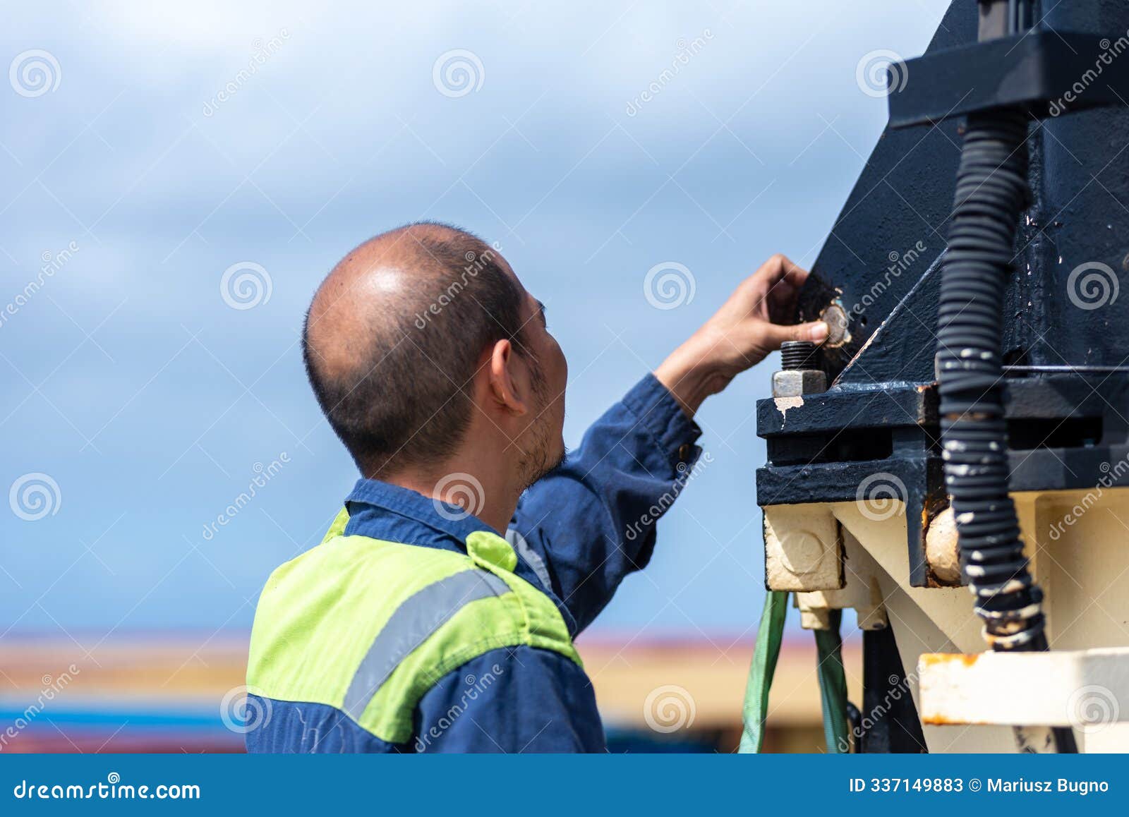 An Engine Officer Conducting a Routine Inspection of Deck Equipment ...