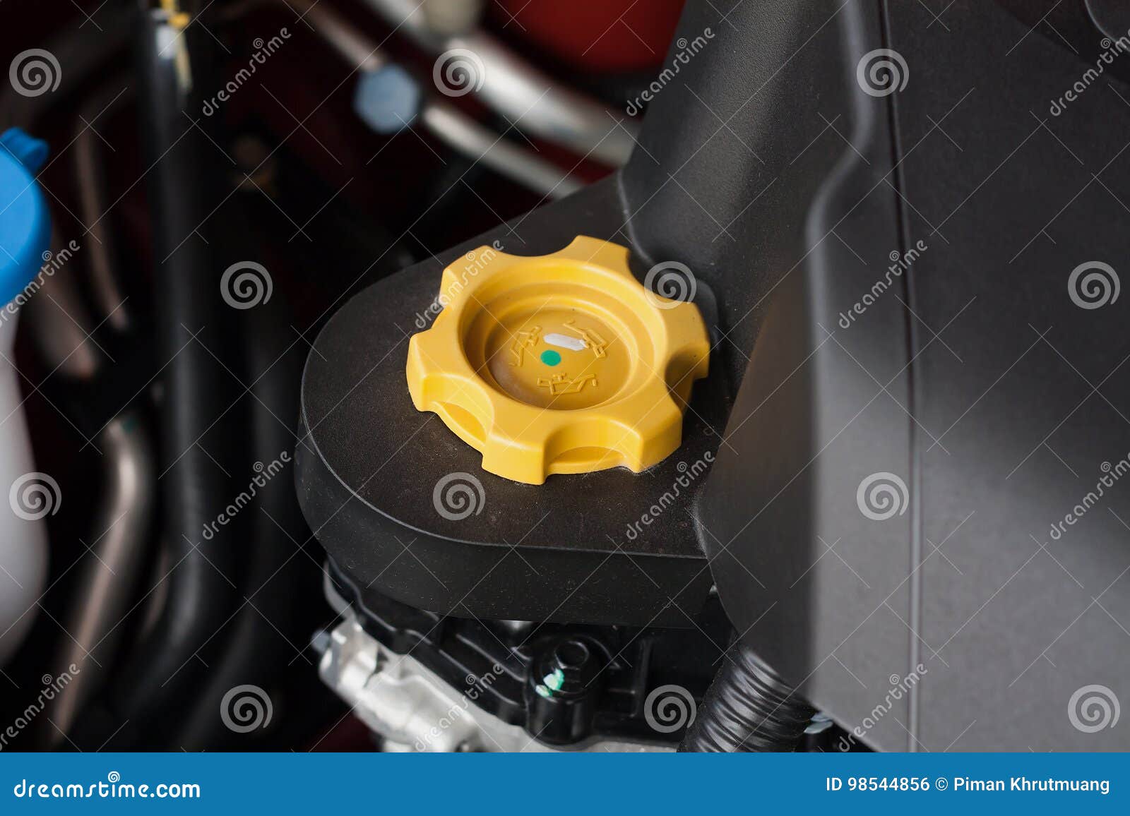 Engine oil cap in car hood stock photo. Image of change - 98544856