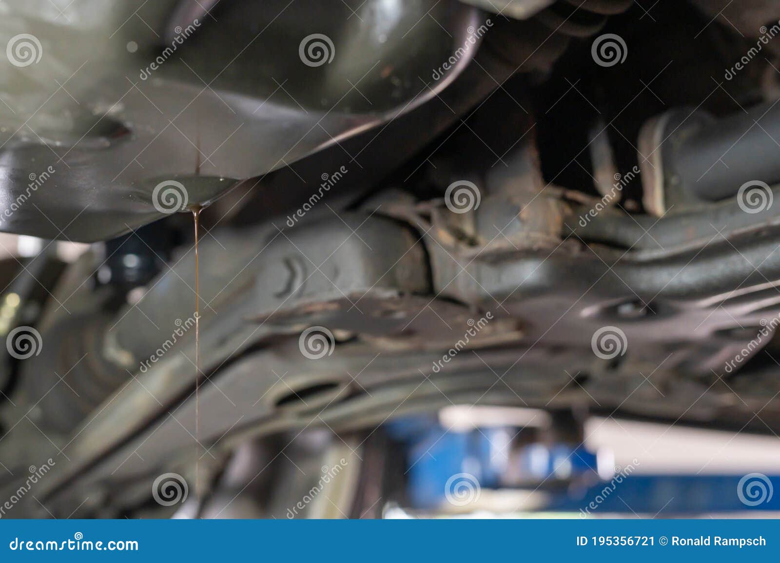 Engine Oil of a Car is Drained Stock Image - Image of underbody, work ...