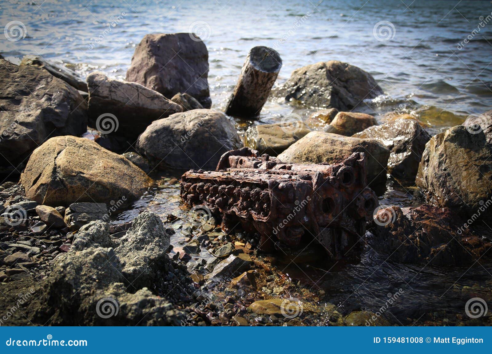 Engine Rusting on a Rocky Beach, Environment and Pollution Stock Photo ...