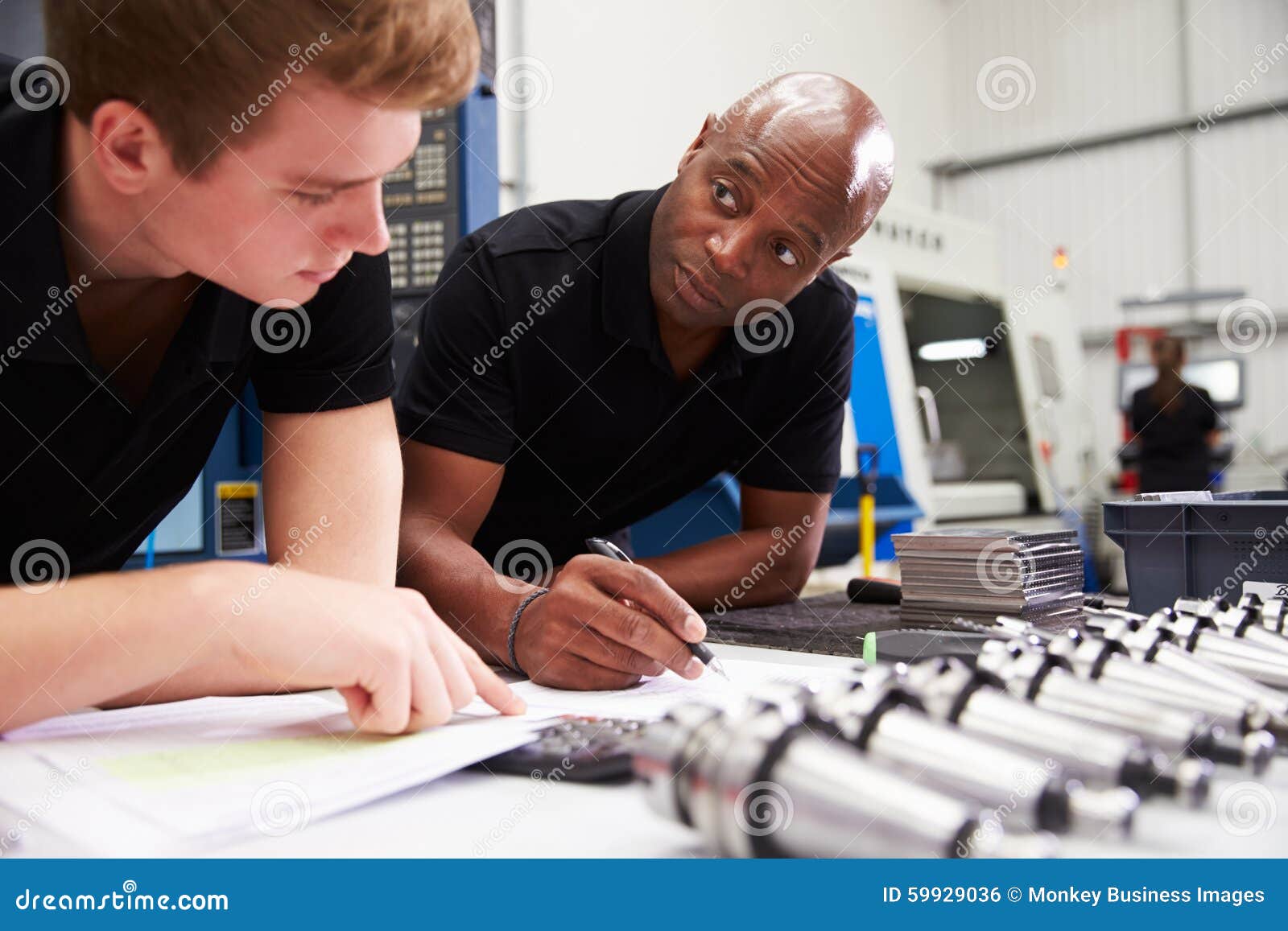 Engineer and Apprentice Planning CNC Machinery Project Stock Photo ...